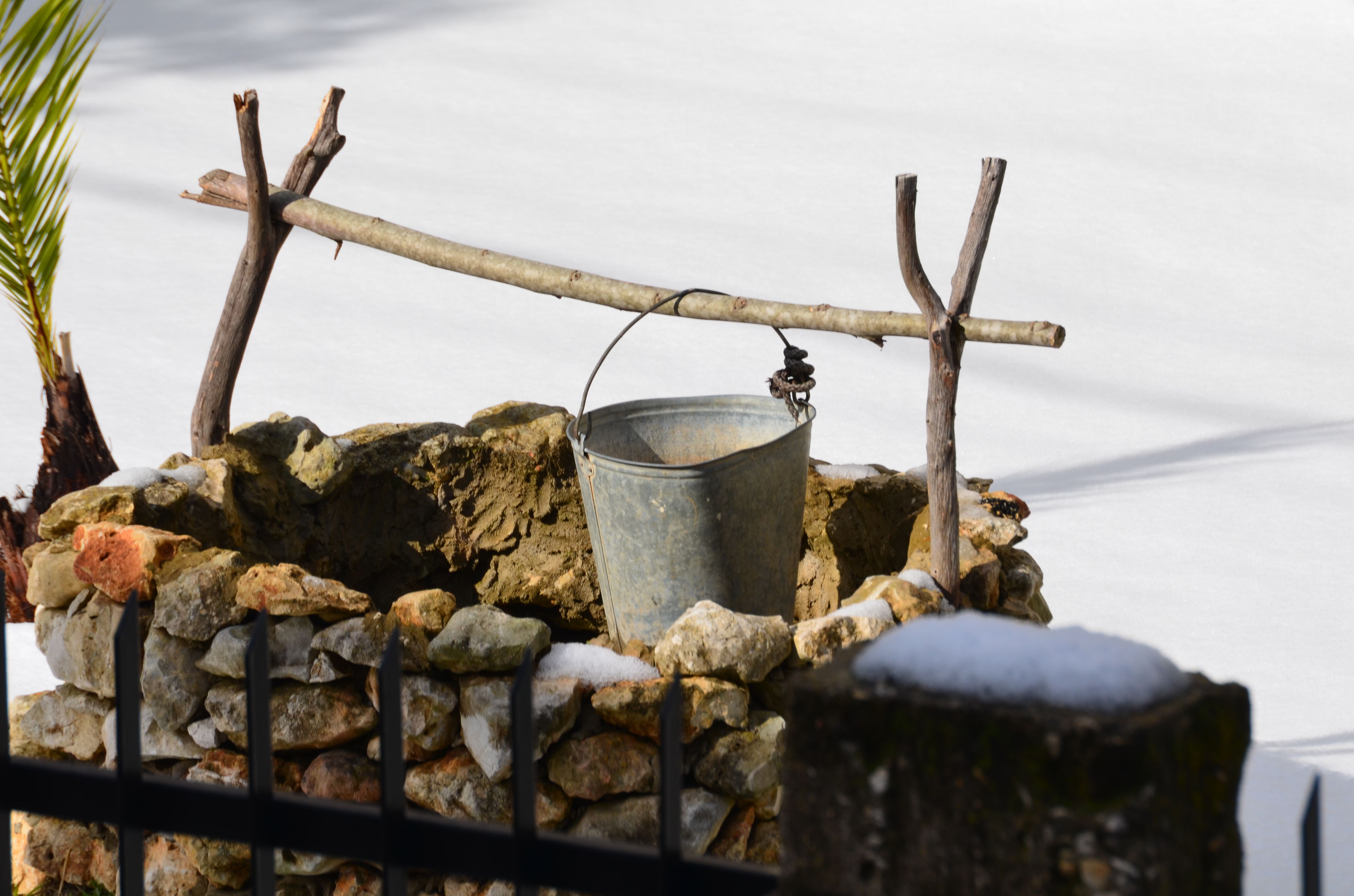 Bucket over Stone Well · Free Stock Photo