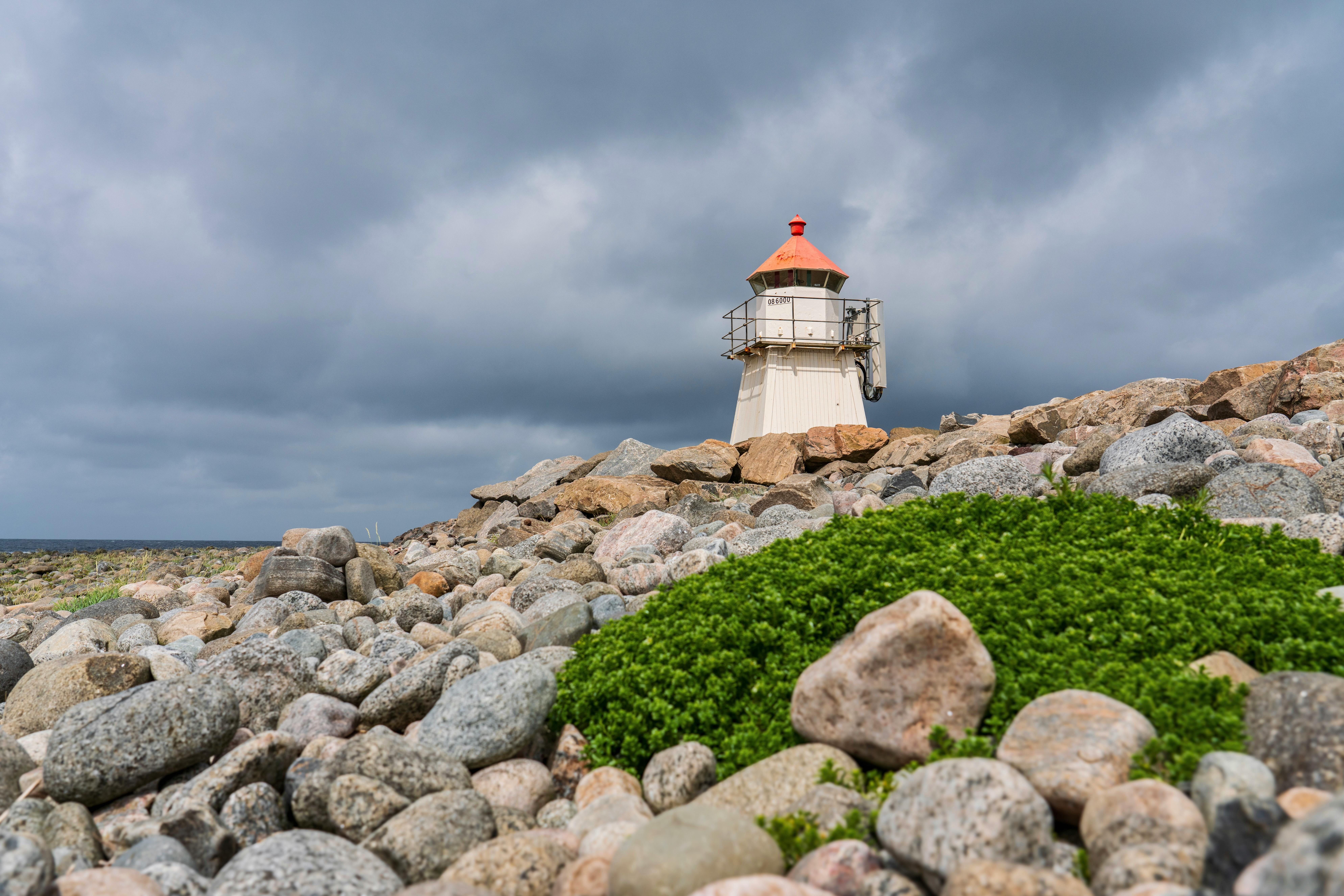 Photo Of Lighthouse On Seaside During Daytime · Free Stock Photo