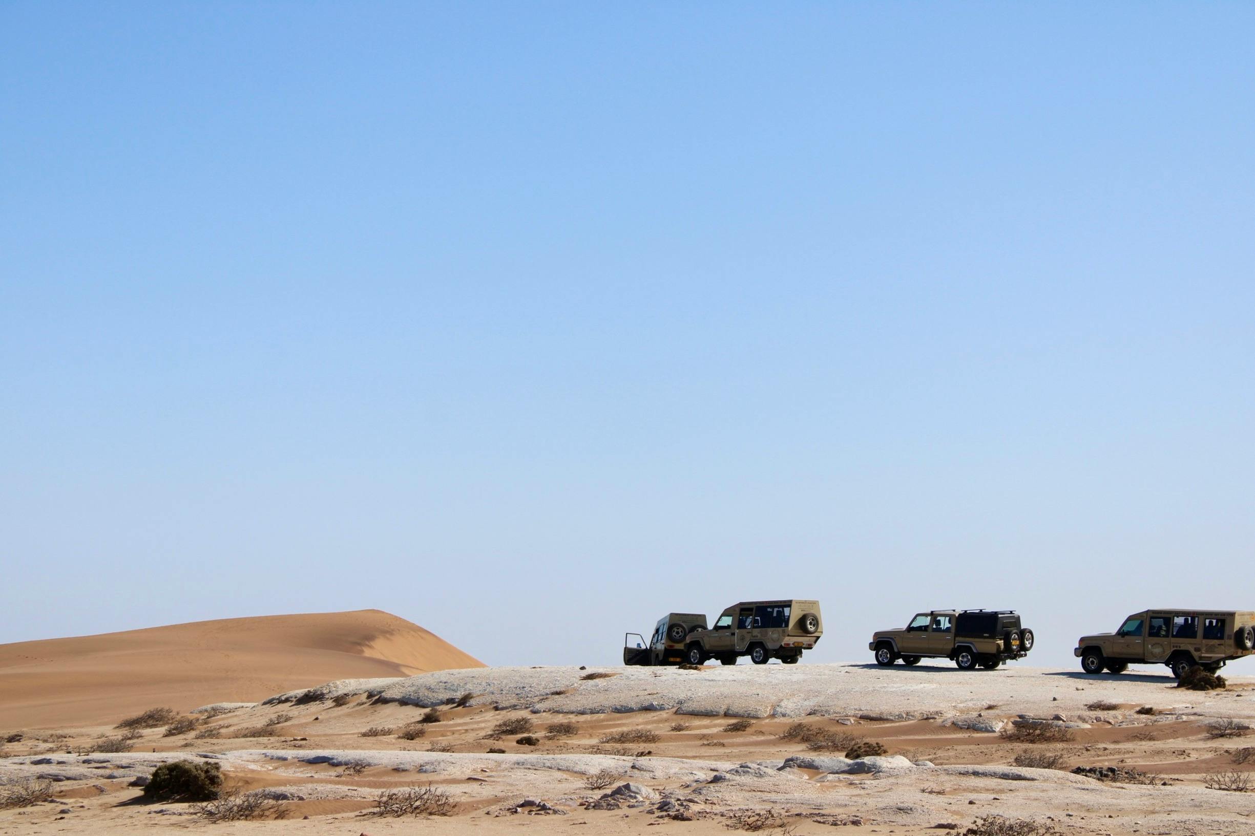 Vehicles Traveling in a Desert · Free Stock Photo