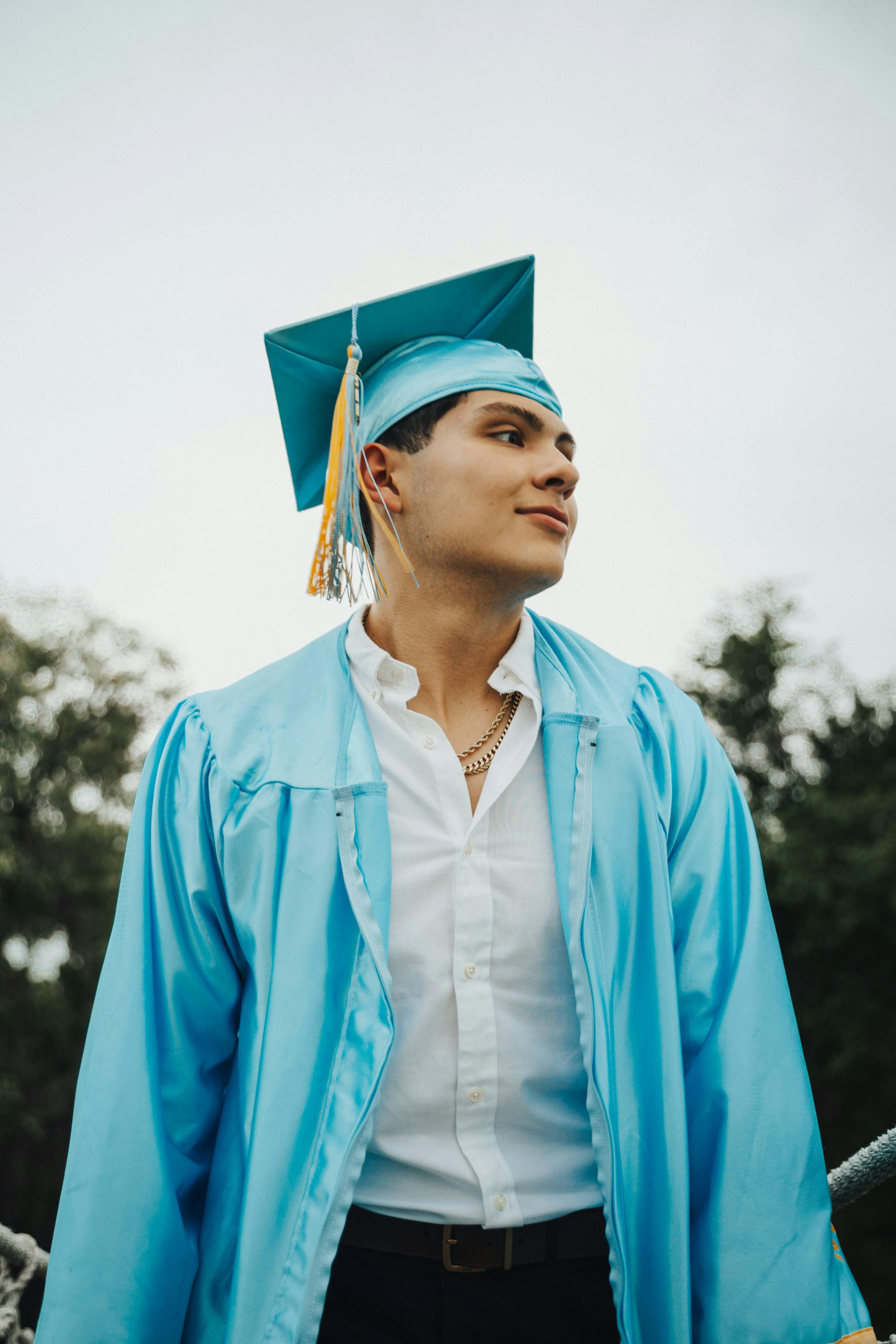 Portrait of Graduate in Gown and Academic Hat · Free Stock Photo