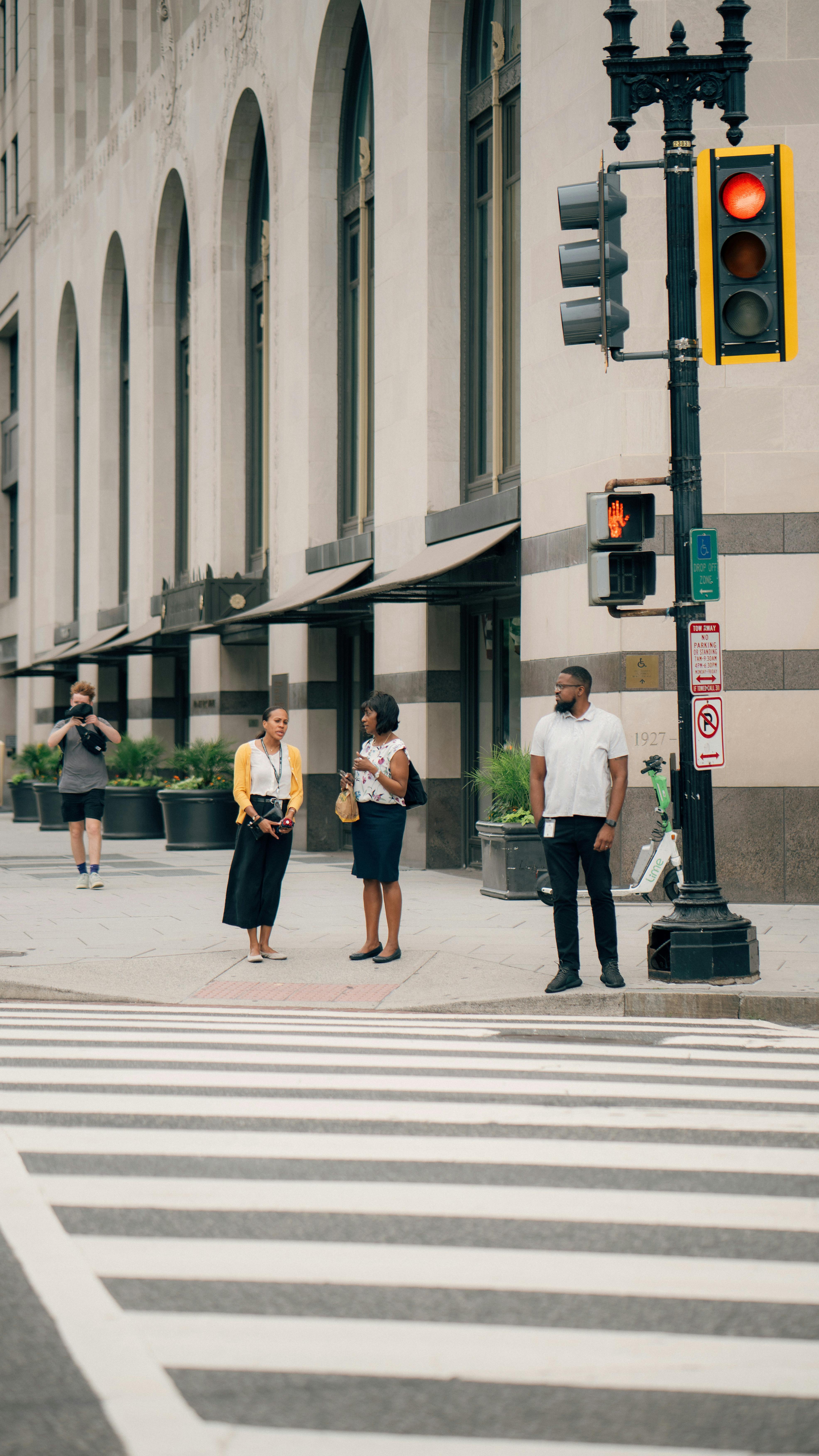 People Waiting at the Red Light on a Crosswalk · Free Stock Photo
