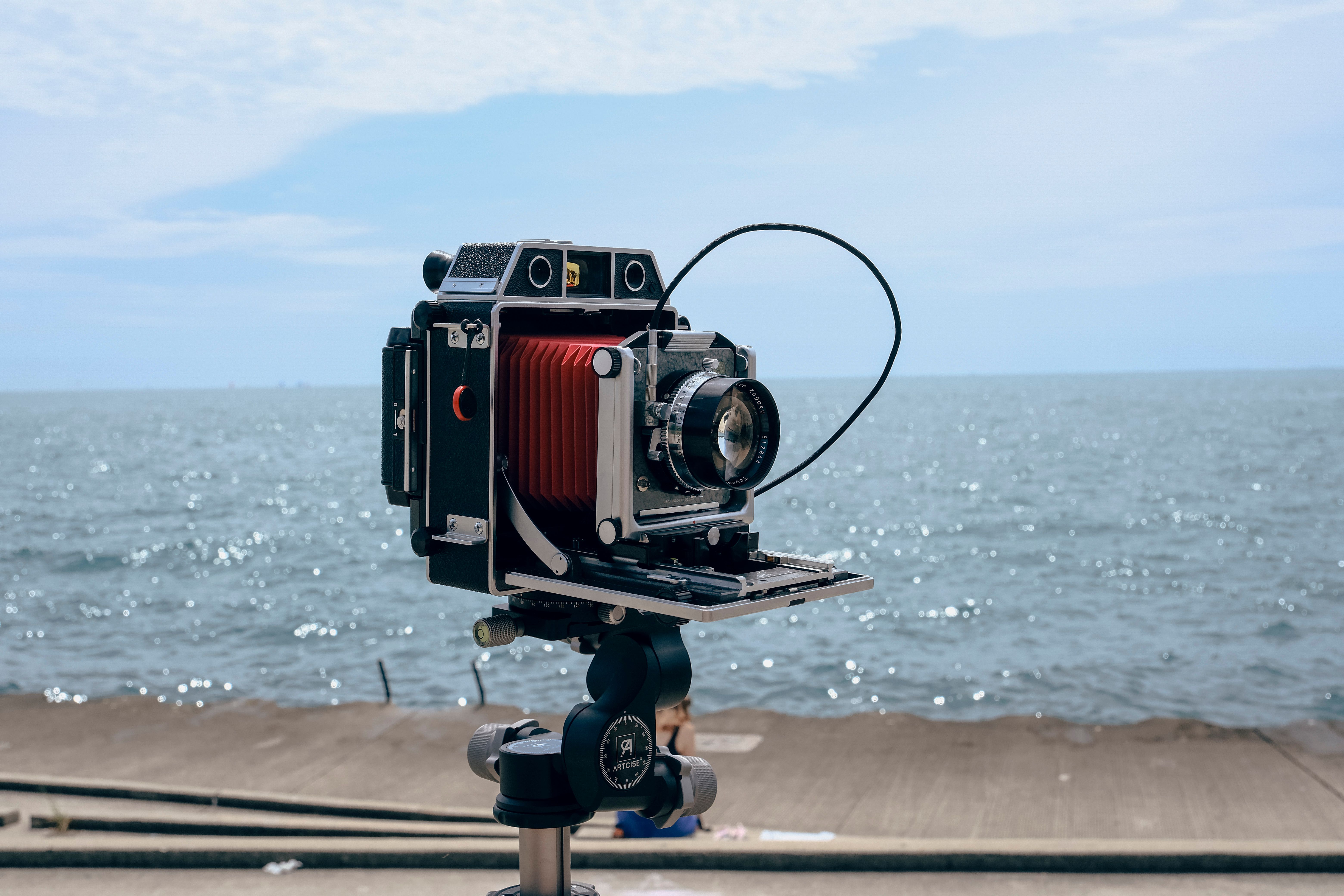 Analogue Camera on Seashore · Free Stock Photo