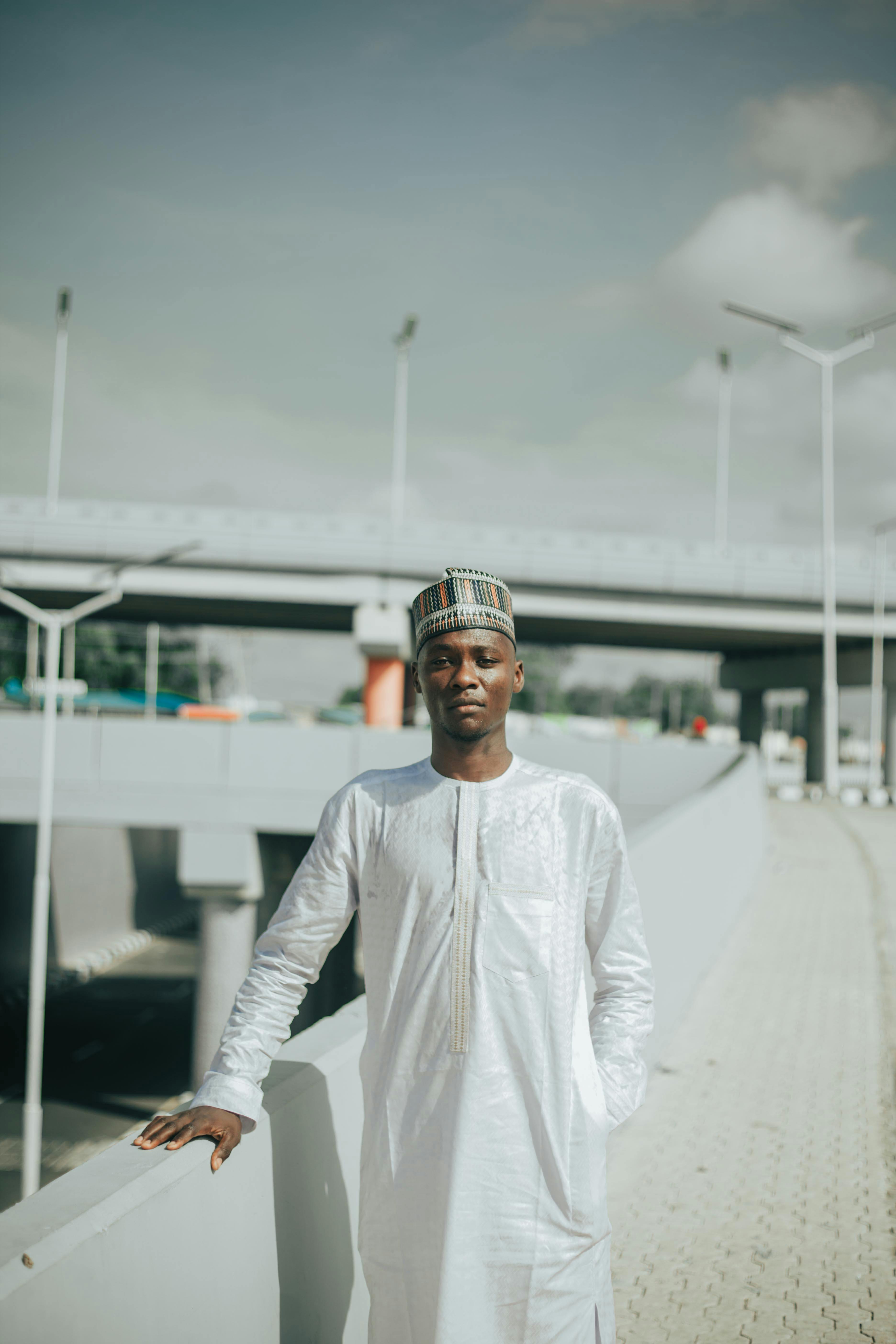 Man in Traditional Hat and White Clothes Standing on Promenade · Free ...