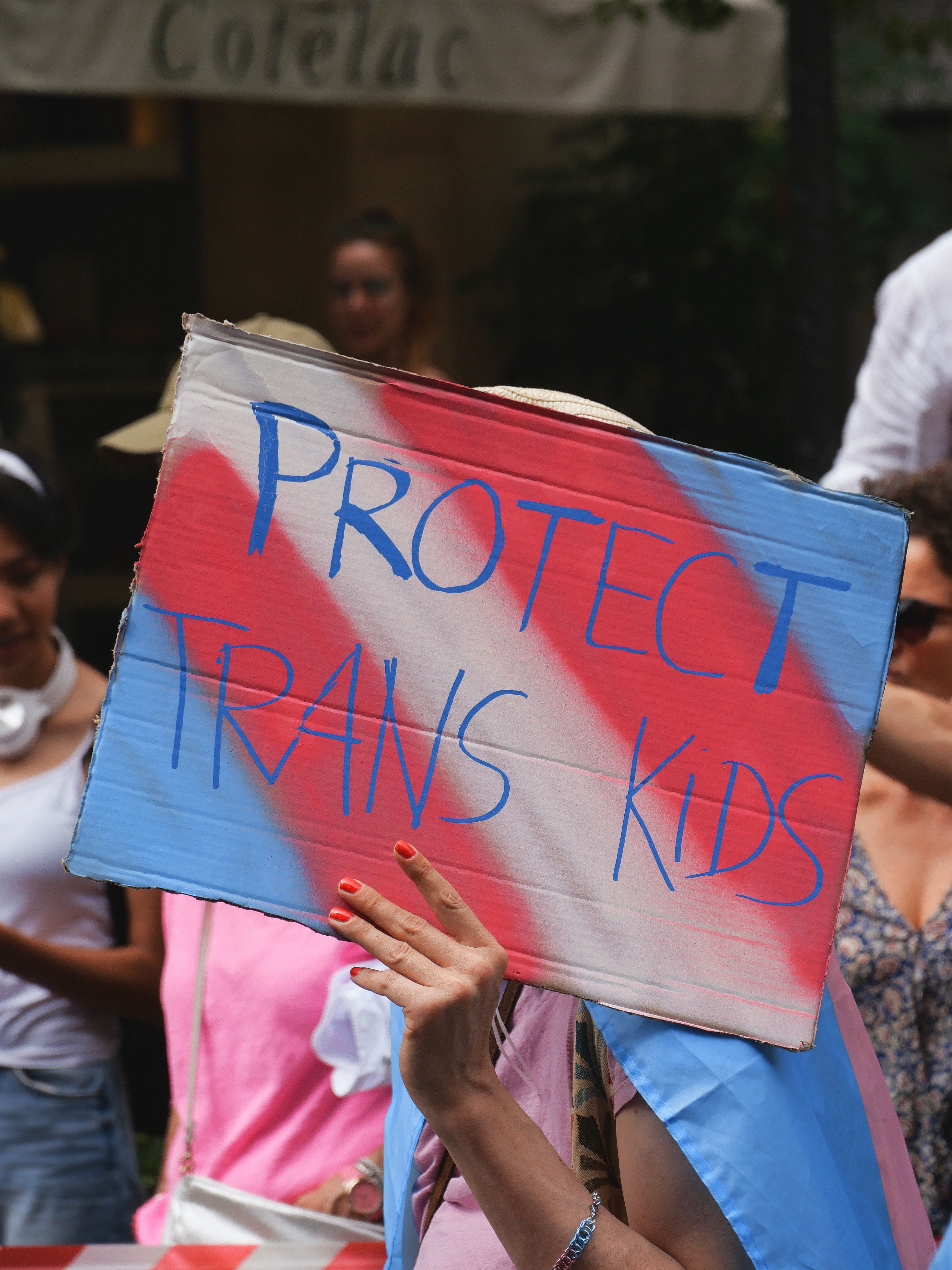 People Protesting with Banner on Street · Free Stock Photo
