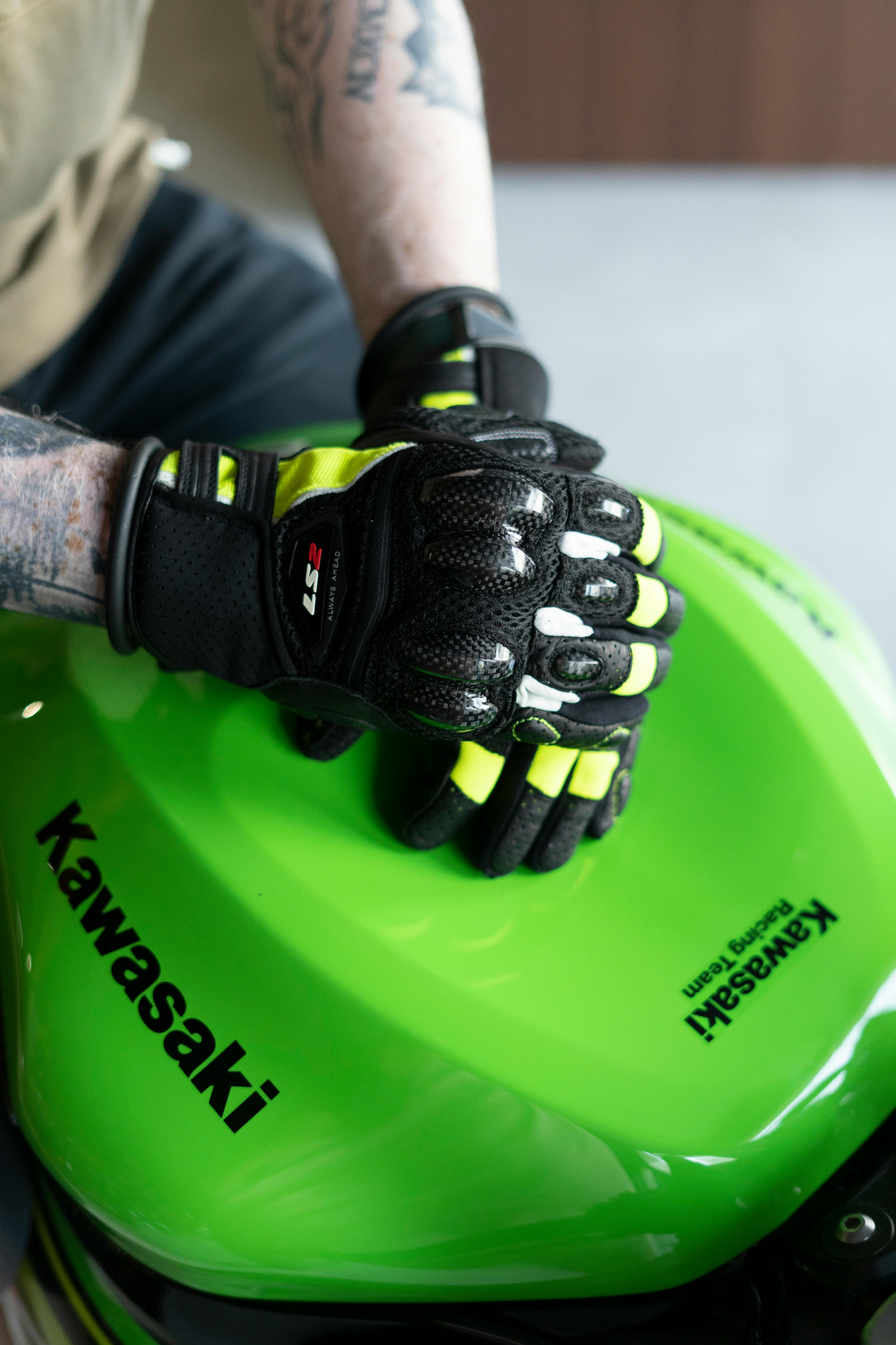 Man Hands in Gloves on Kawasaki Motorbike · Free Stock Photo