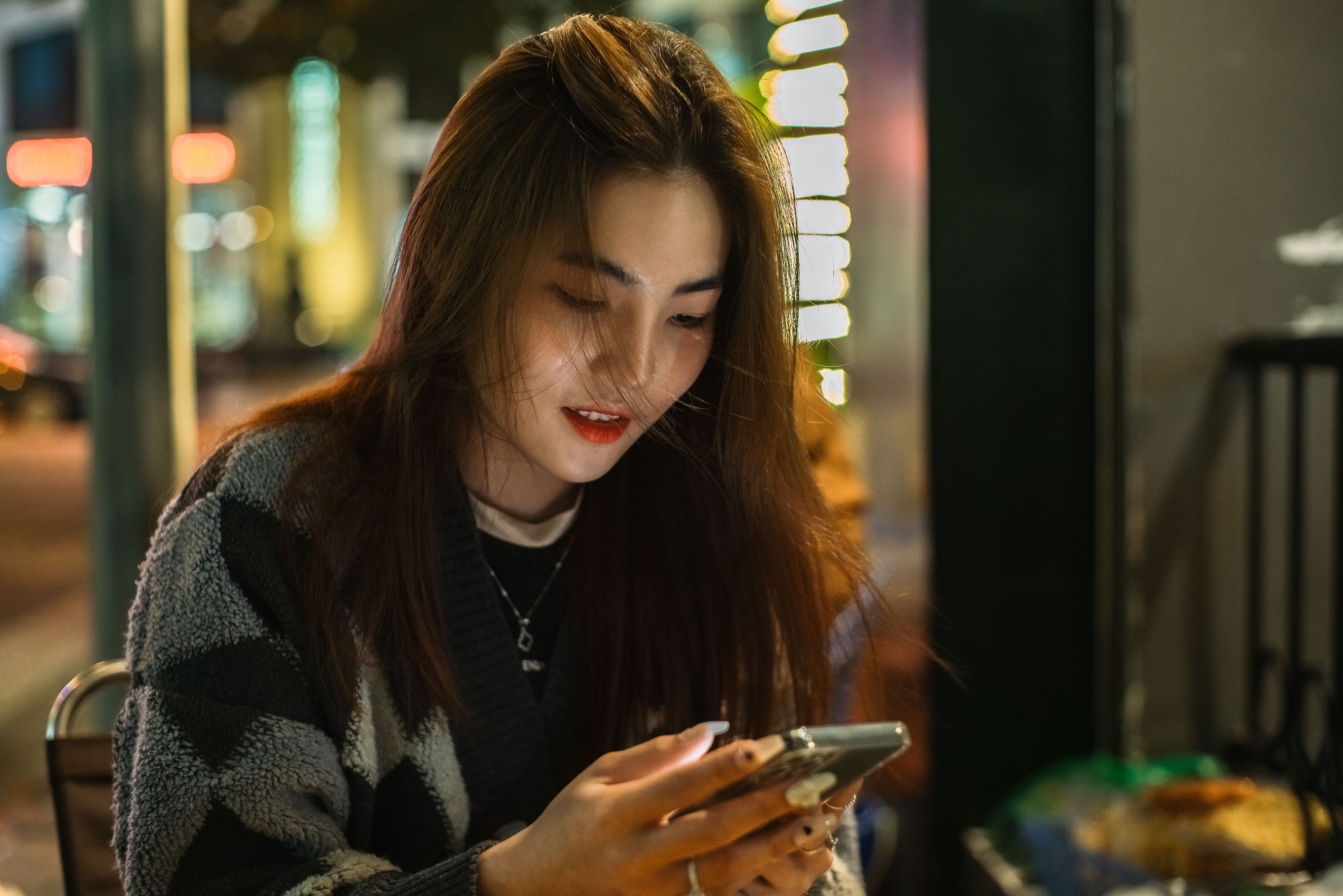 Young Woman Texting on the Sidewalk · Free Stock Photo