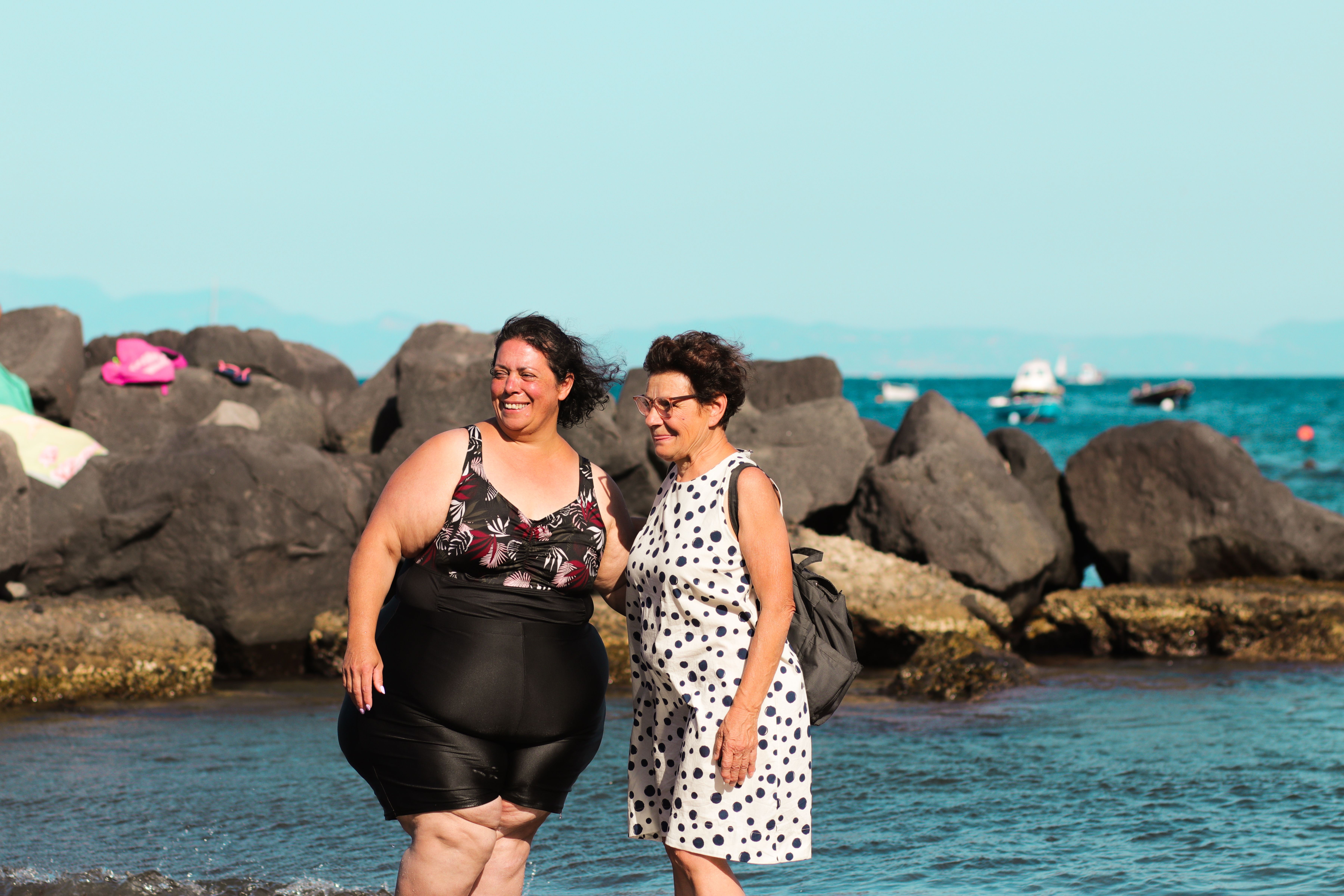 Women Standing on Seashore · Free Stock Photo