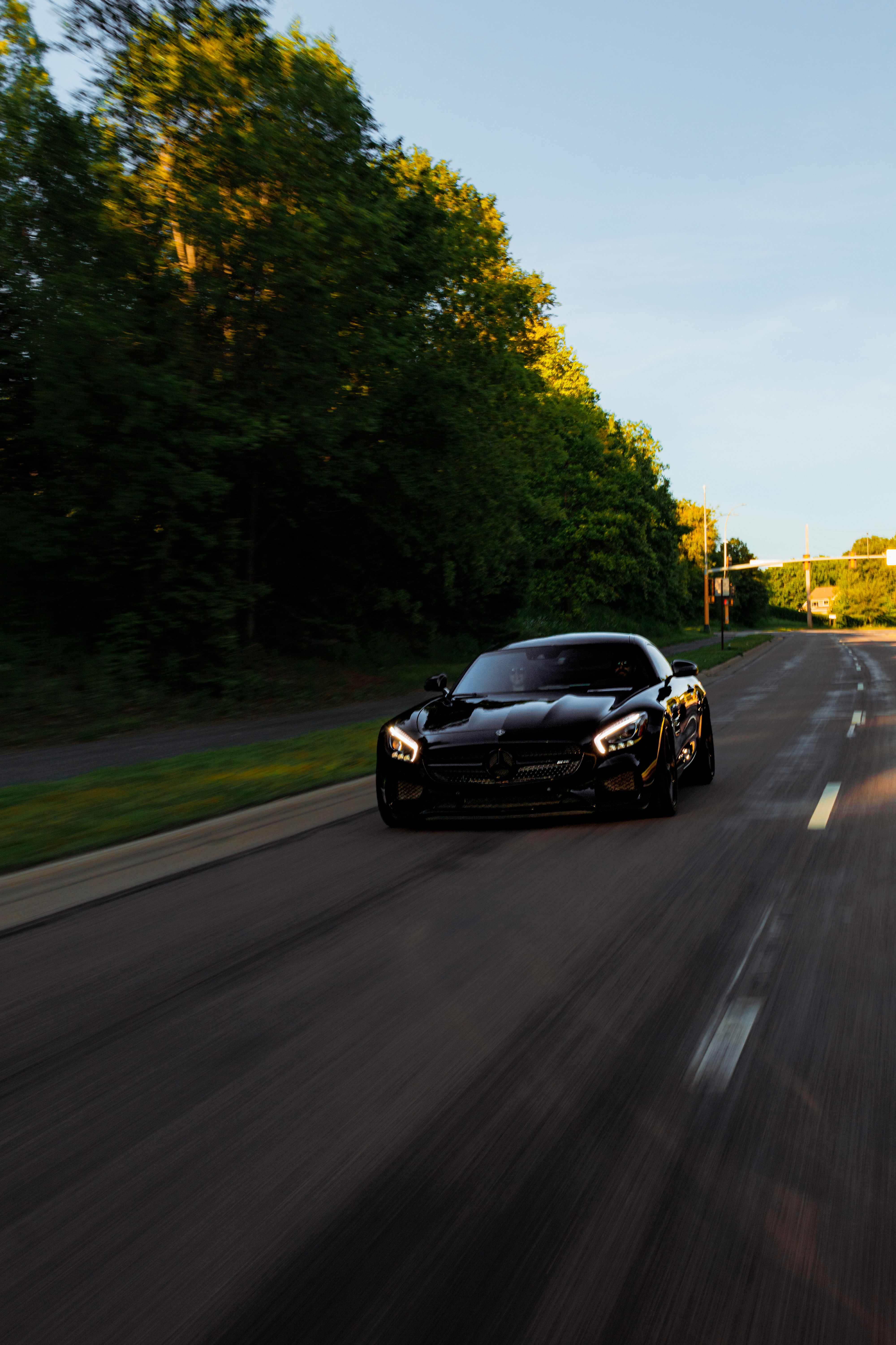 People Riding on an Orange Sports Car Moving Fastly on the Road · Free ...