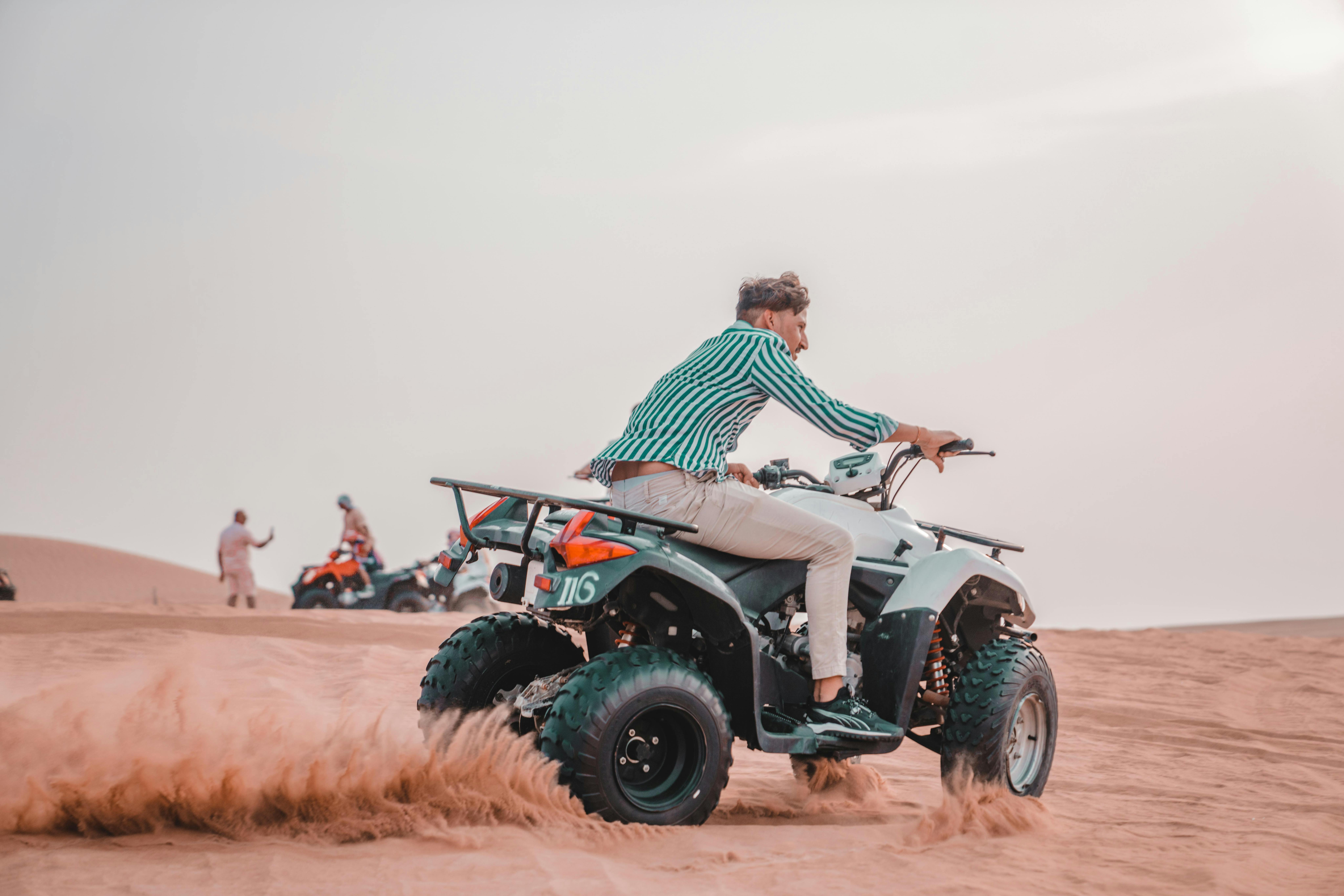 Man Riding Quad on Desert · Free Stock Photo