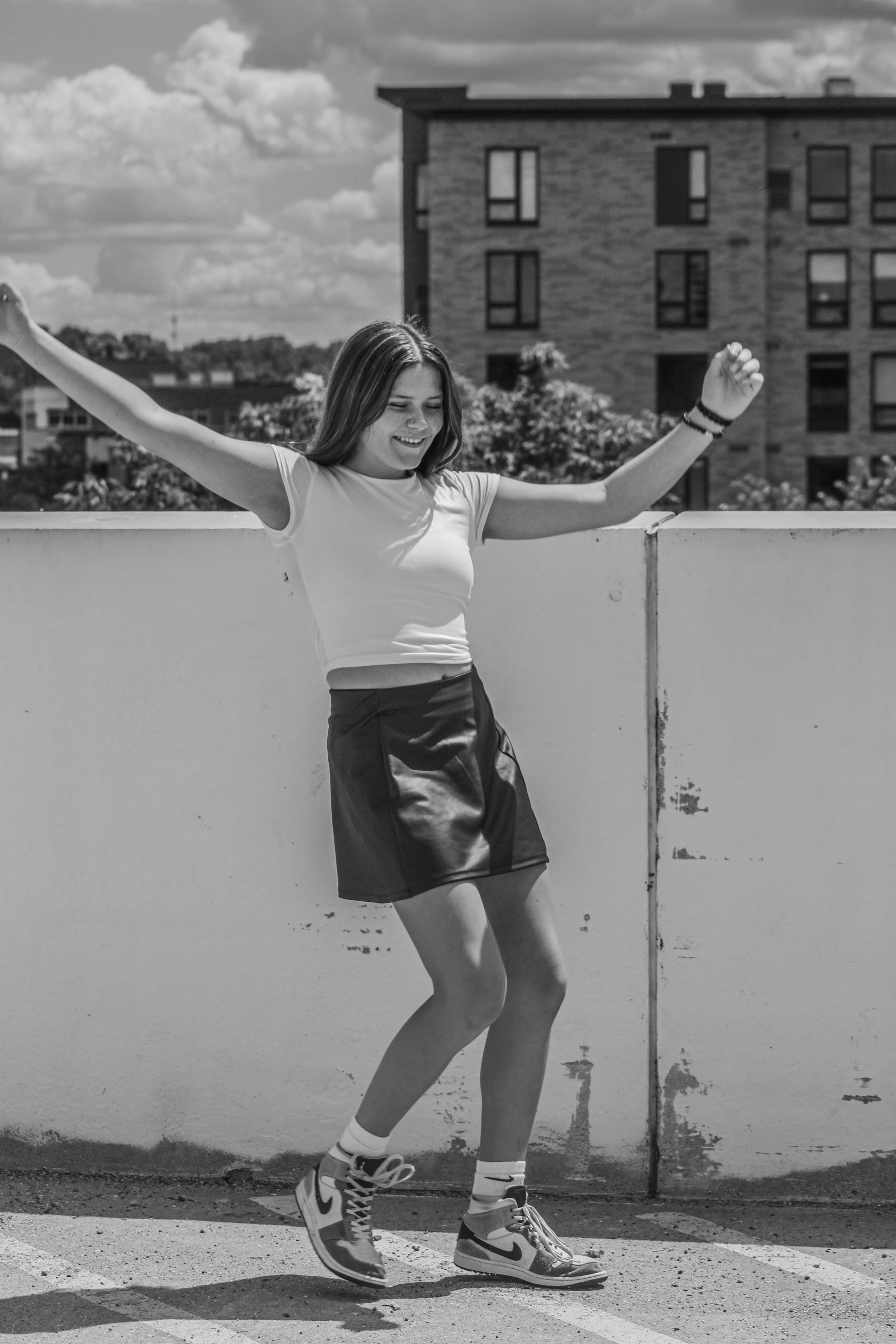 Woman in Pink Dress Doing Jump Shot While Extending Arms Under White ...
