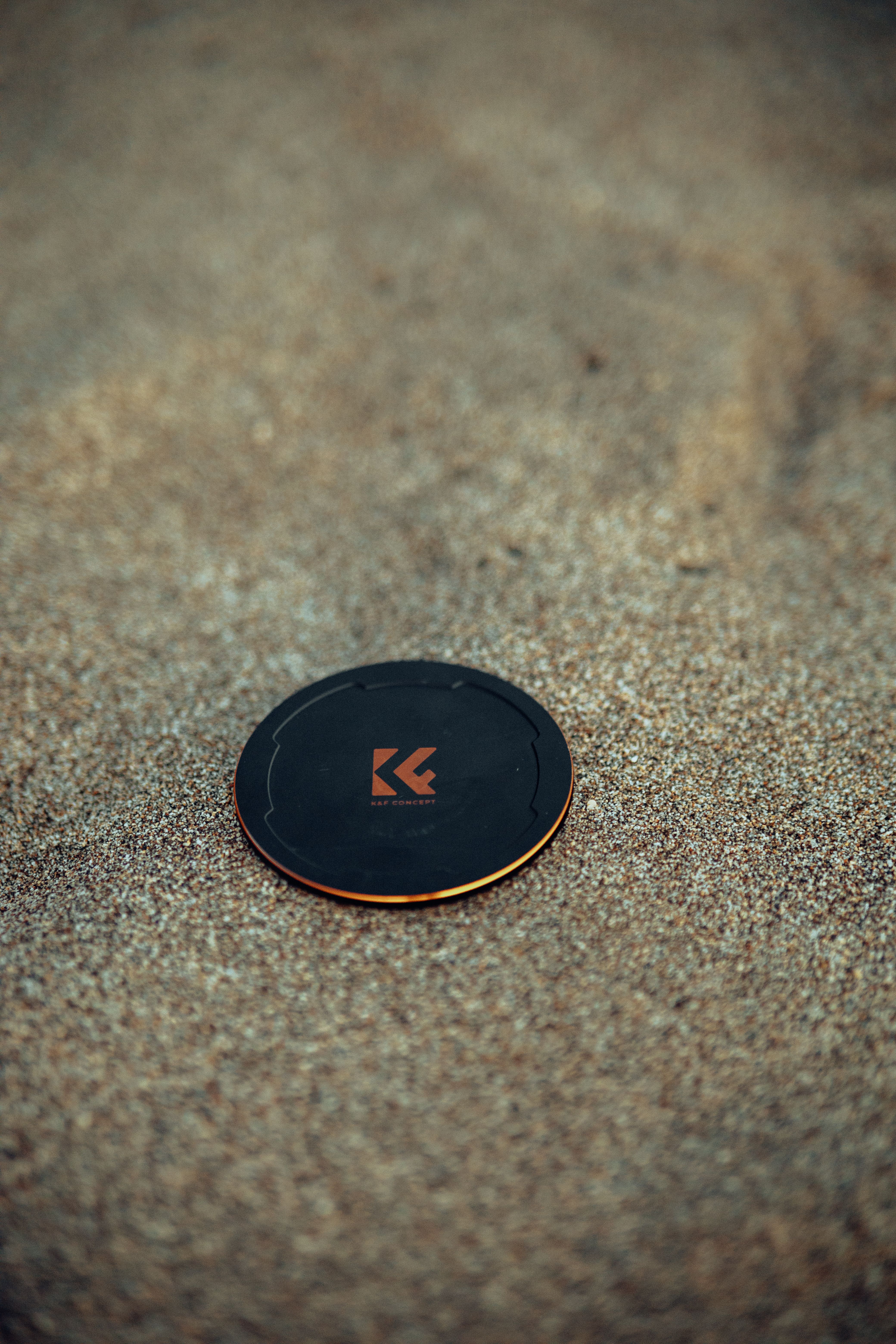 Round Item in Sand · Free Stock Photo