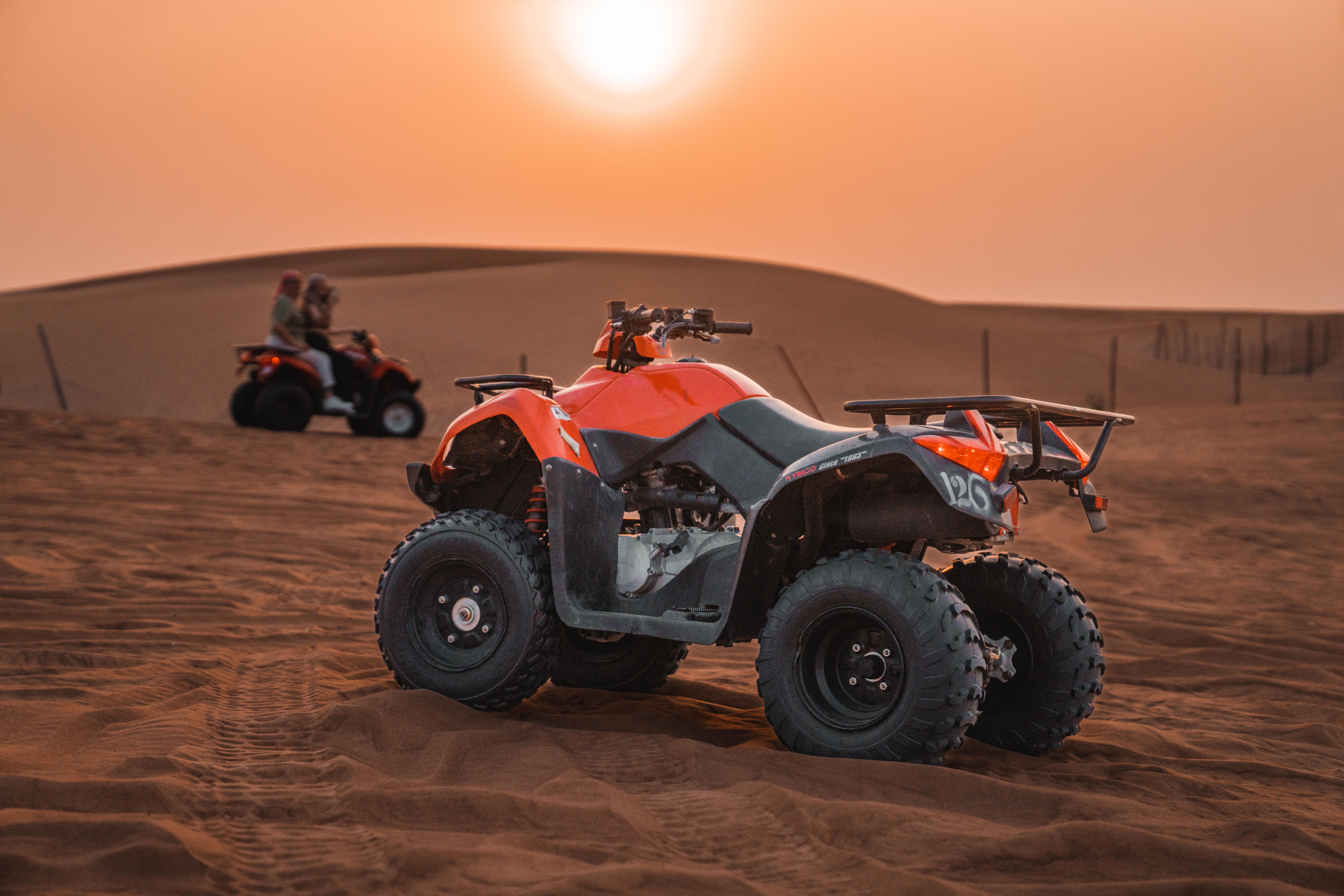 Quad on Barren Desert at Sunset · Free Stock Photo