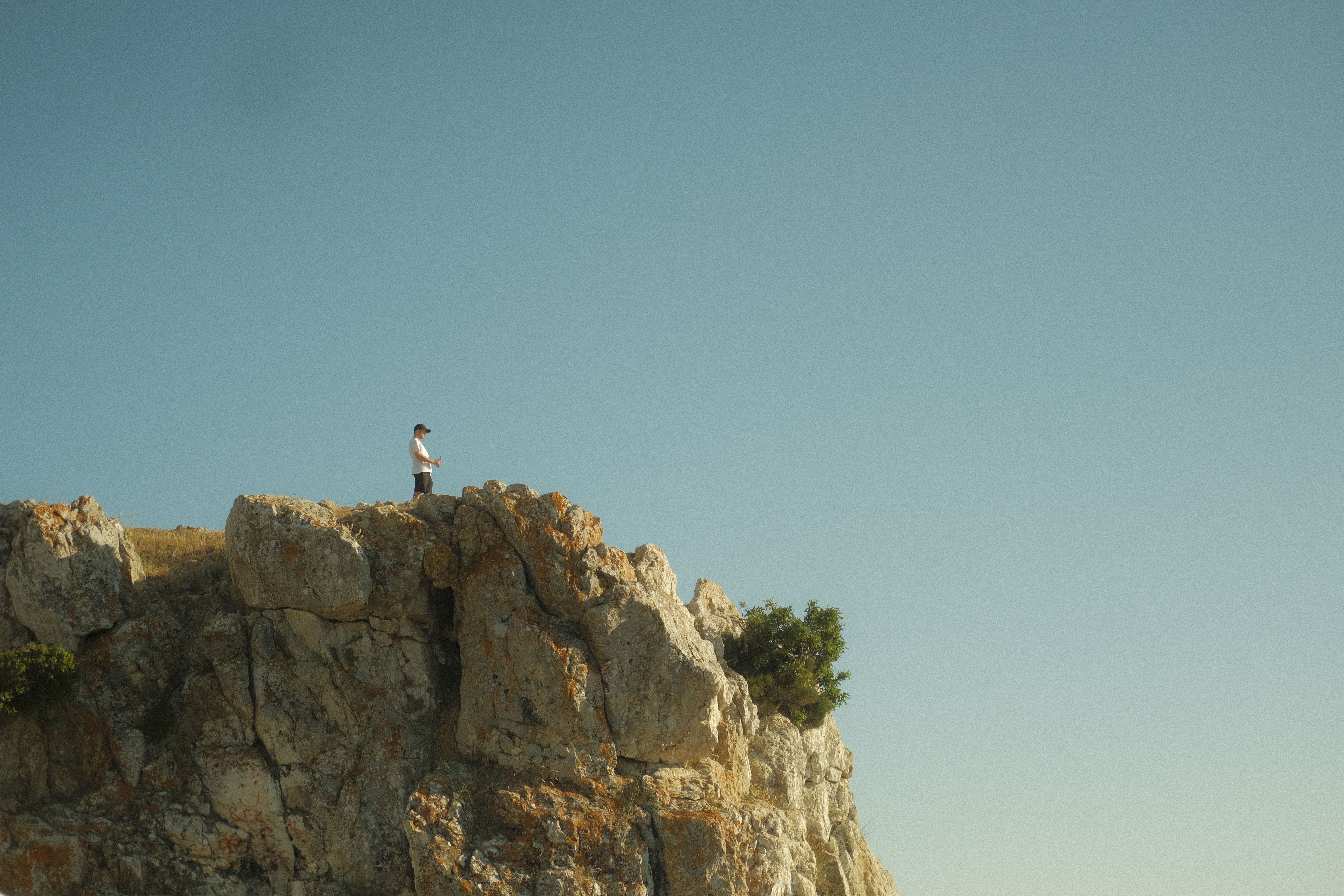 Man Standing on a Cliff · Free Stock Photo