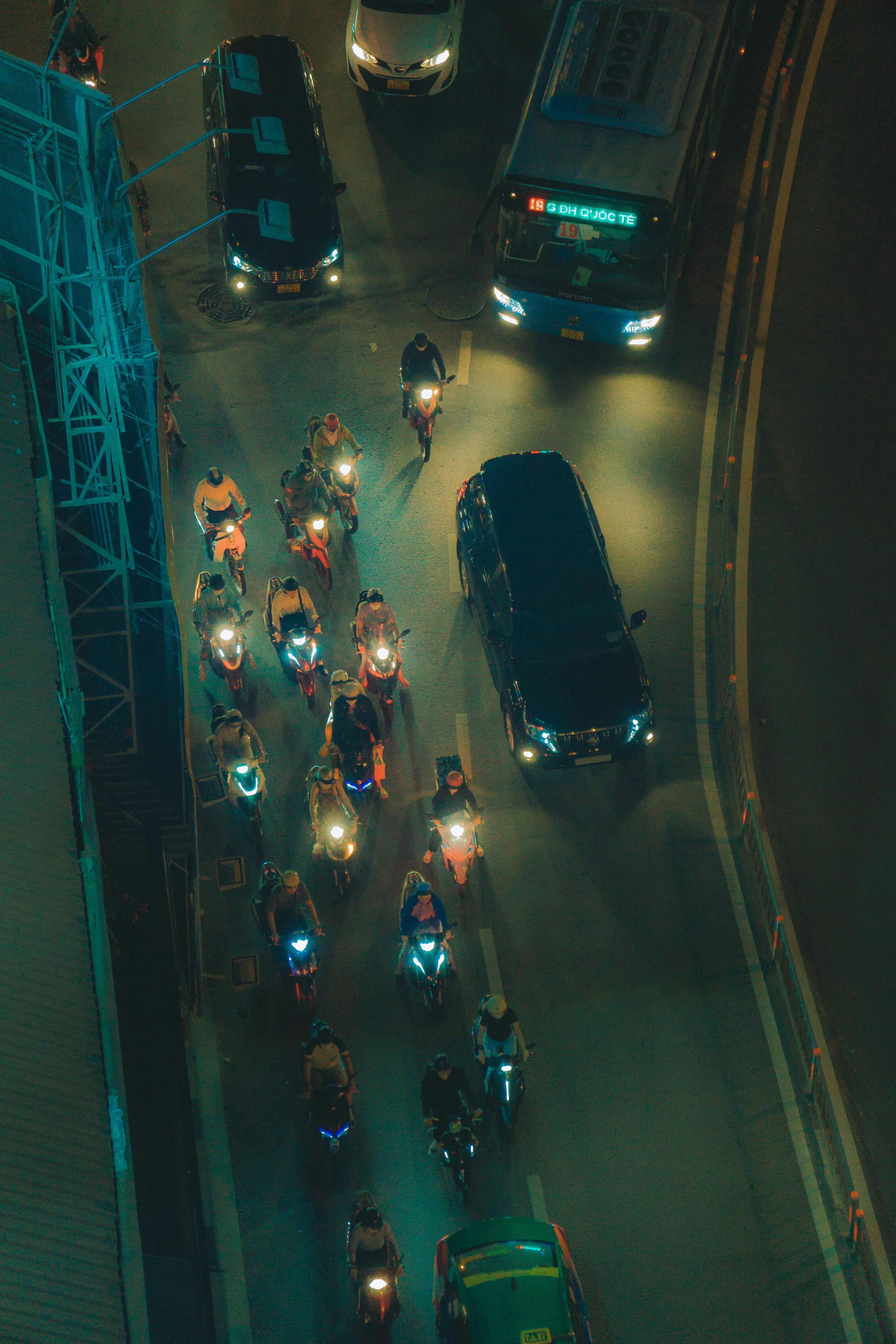 An overhead view of a busy street with cars and motorcycles · Free ...