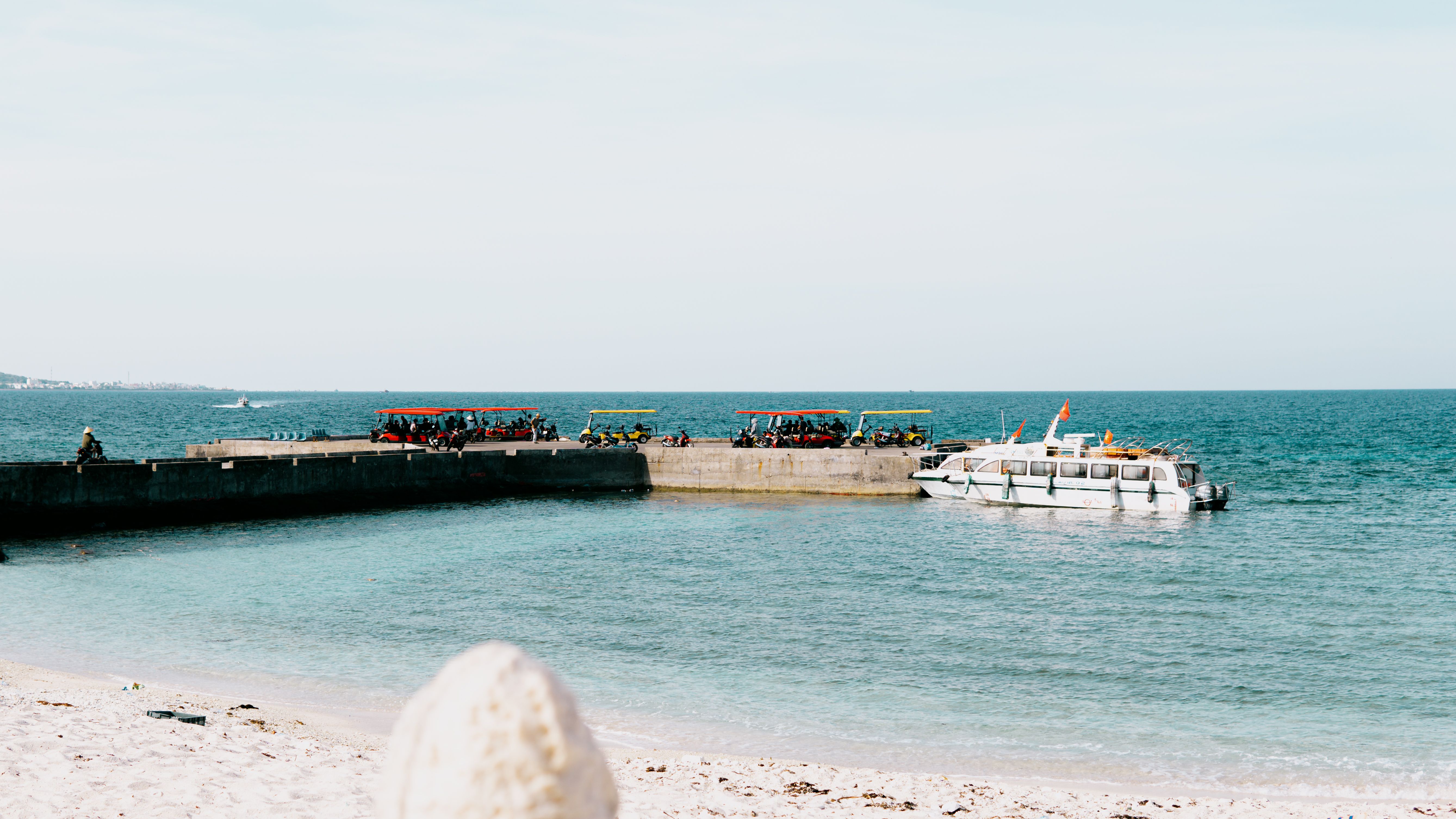 View of a Group of People Standing on the Pier · Free Stock Photo