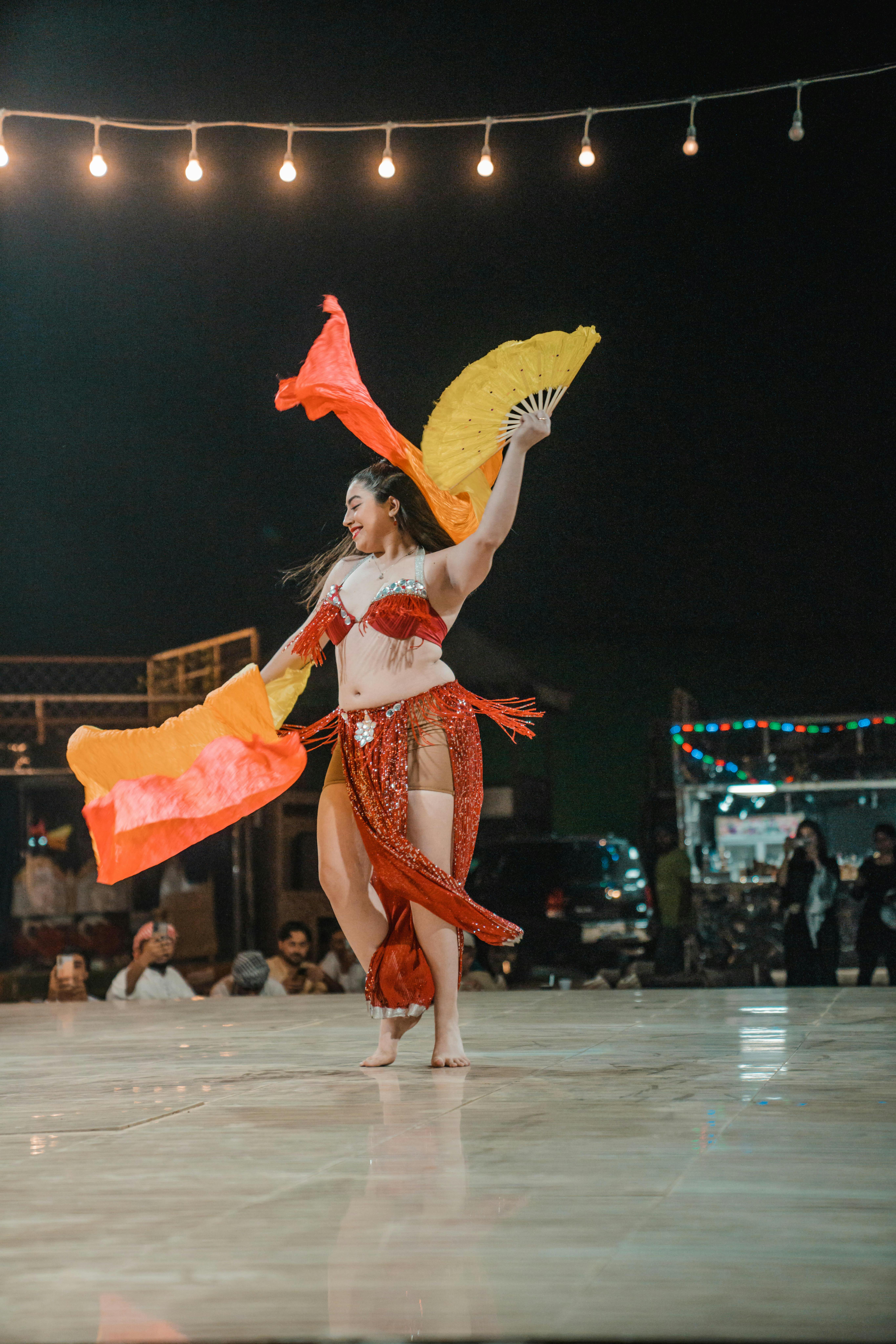 Dancer with Fan on Stage at Night · Free Stock Photo
