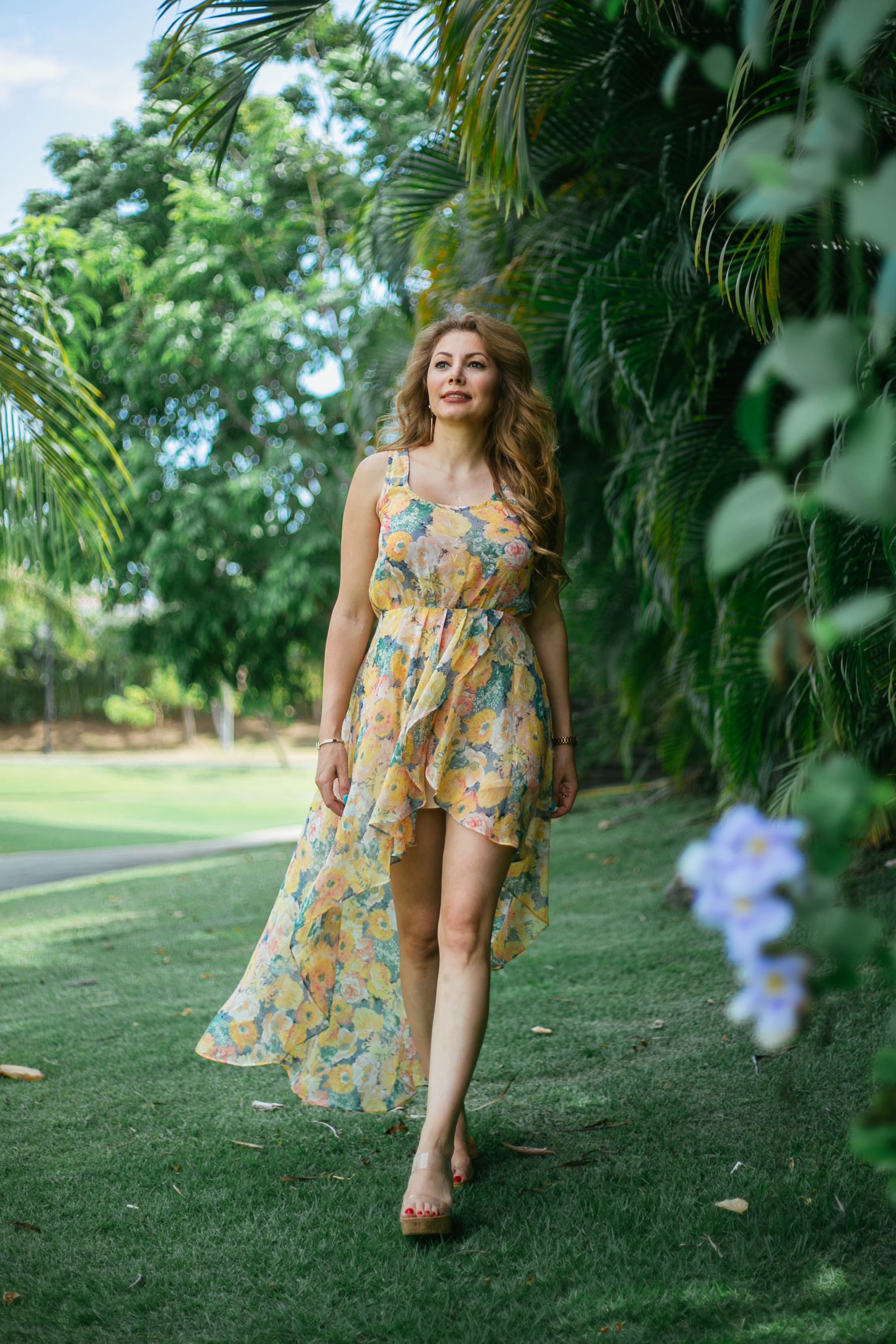 Blonde Woman in Sundress Walking in Garden · Free Stock Photo