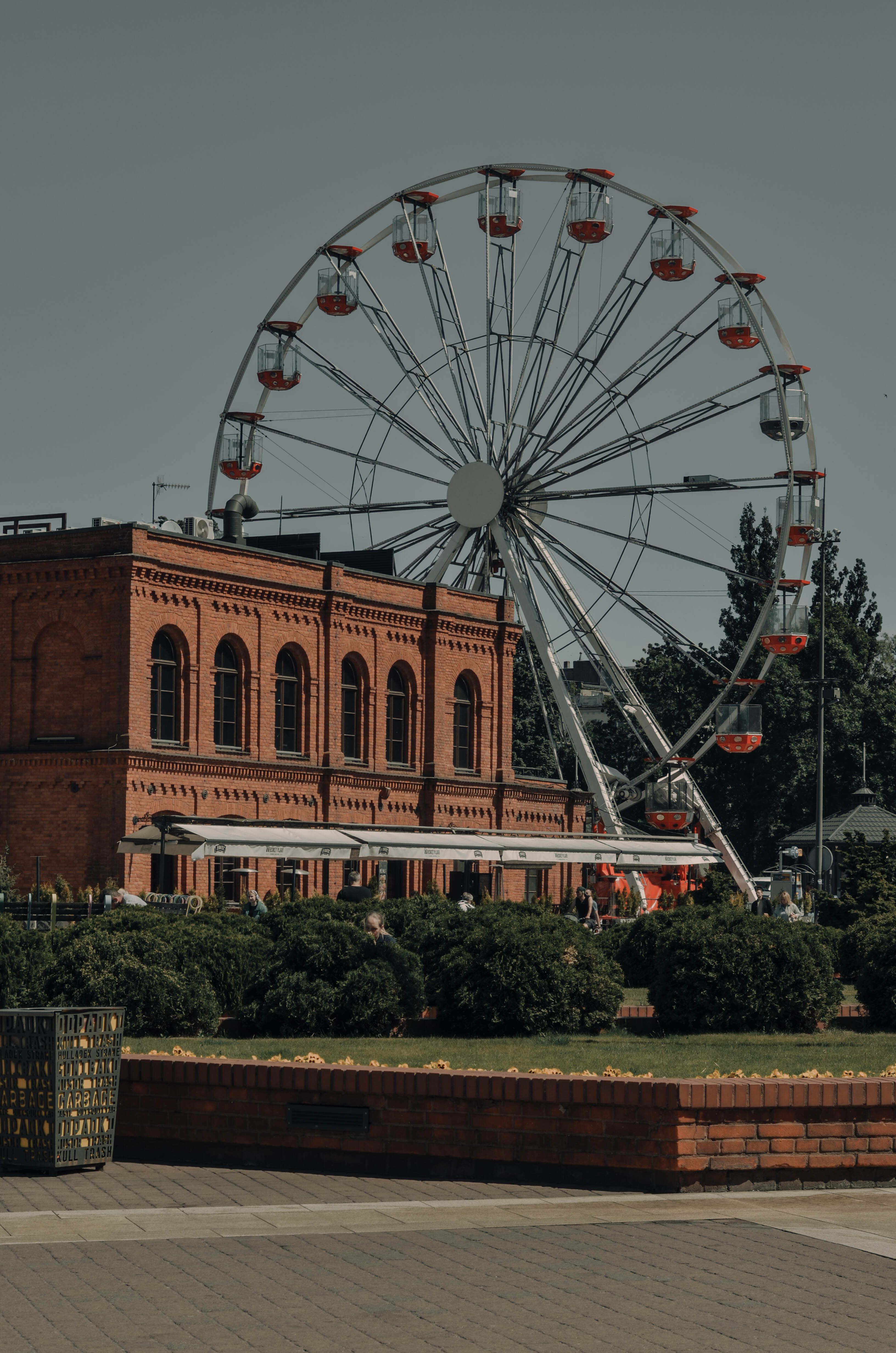 Ferris Wheel by Brick Building · Free Stock Photo