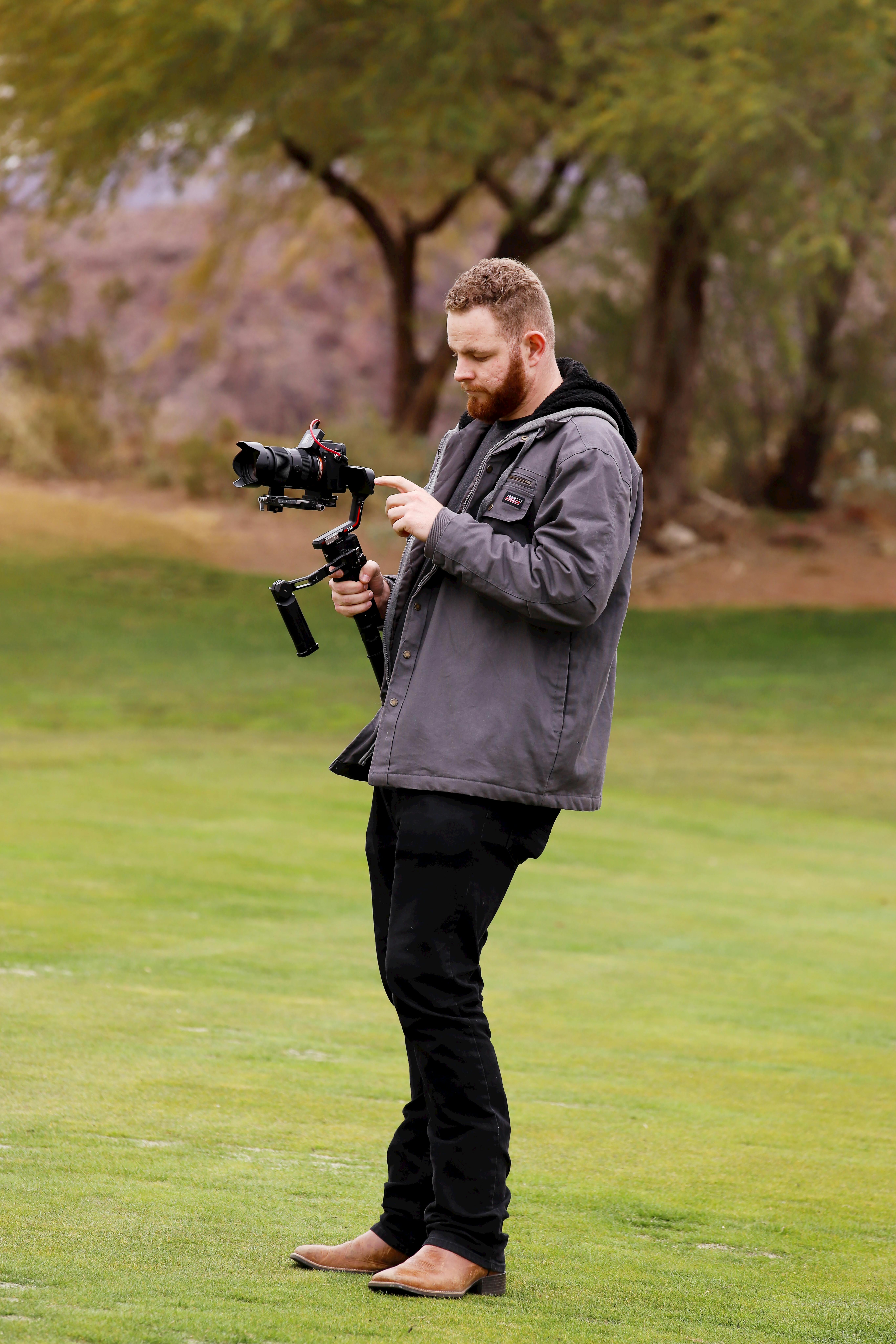 Photo of Man Holding Digital Camera · Free Stock Photo