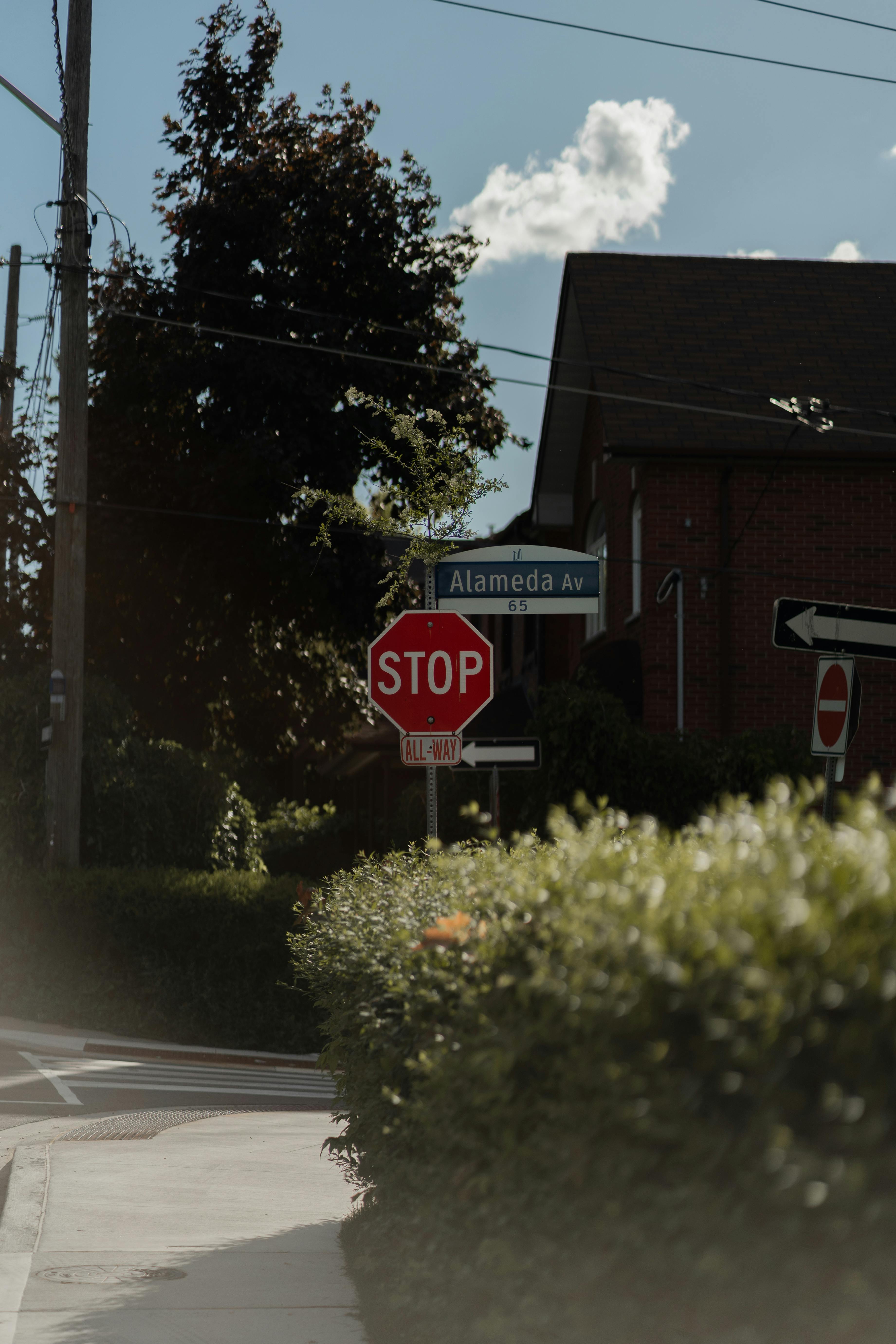 Stop Sign on Street in Town · Free Stock Photo