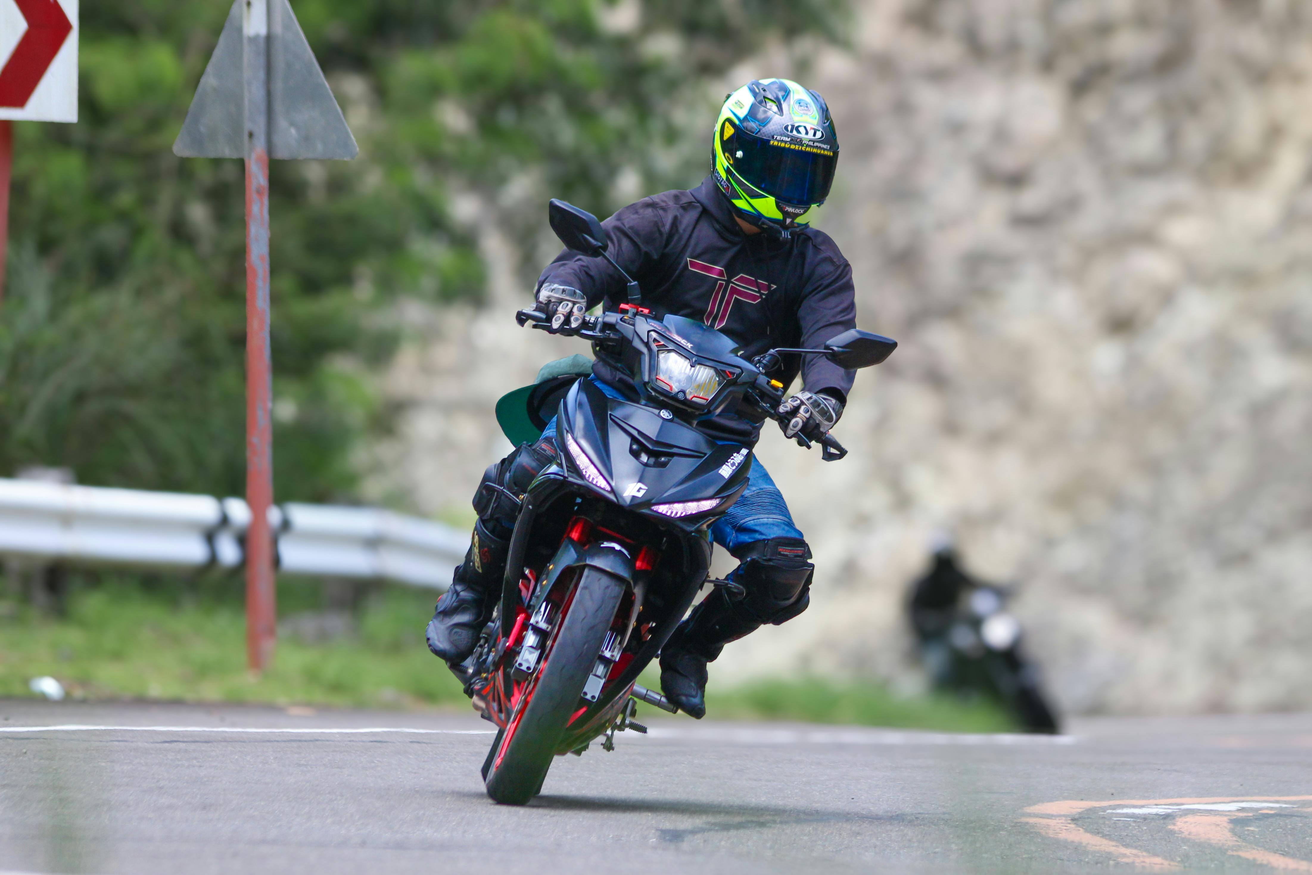 Biker Riding a Yamaha T-150 · Free Stock Photo