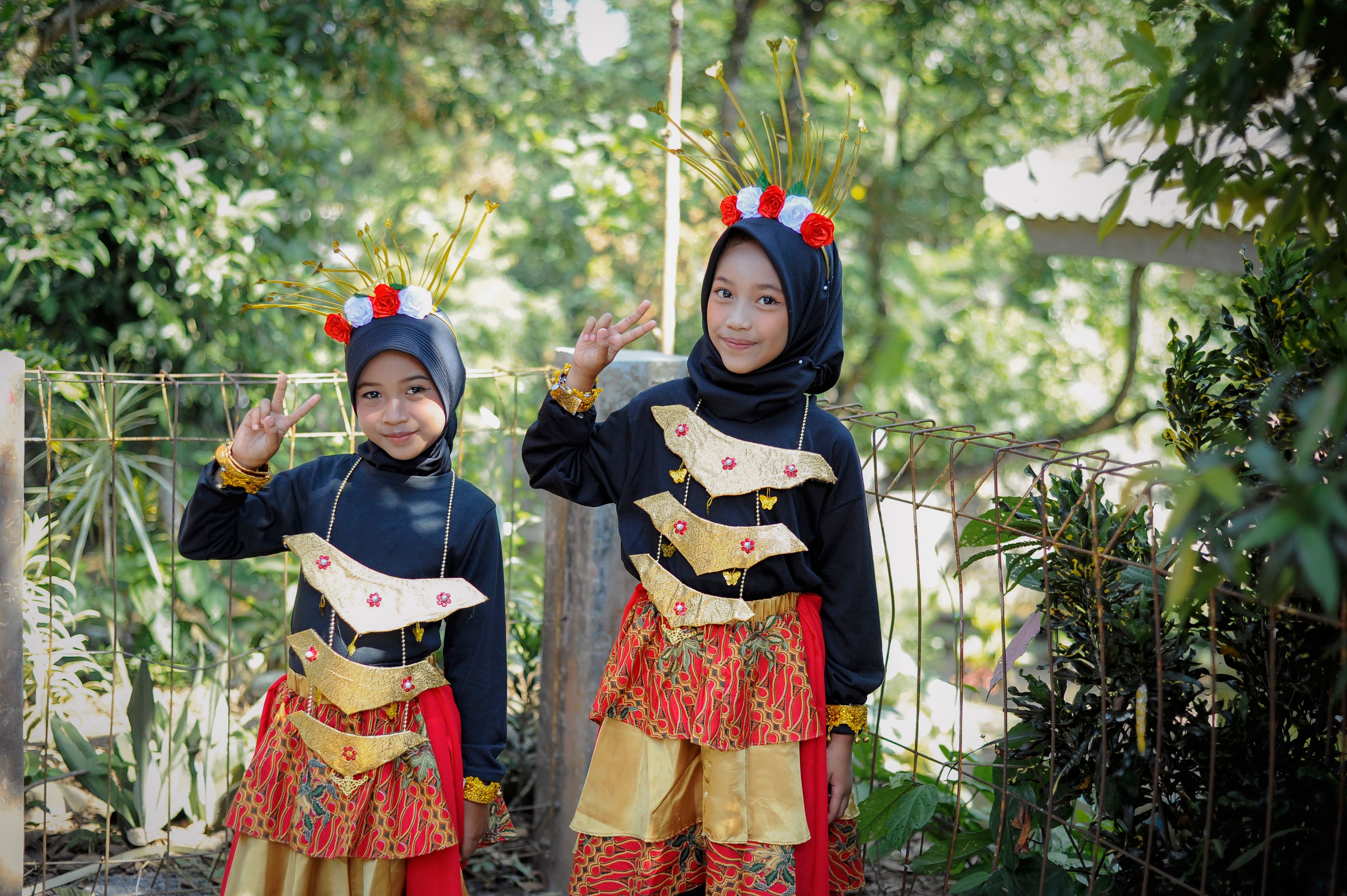 Small Girls in Traditional Costumes · Free Stock Photo