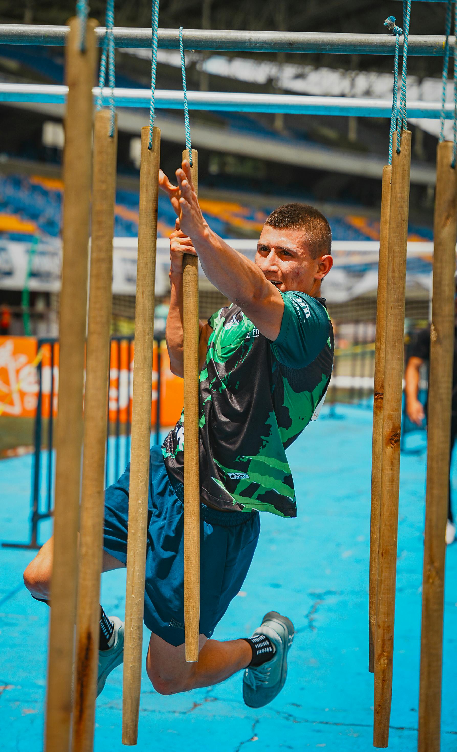 Athlete in Obstacle Course at Stadium · Free Stock Photo
