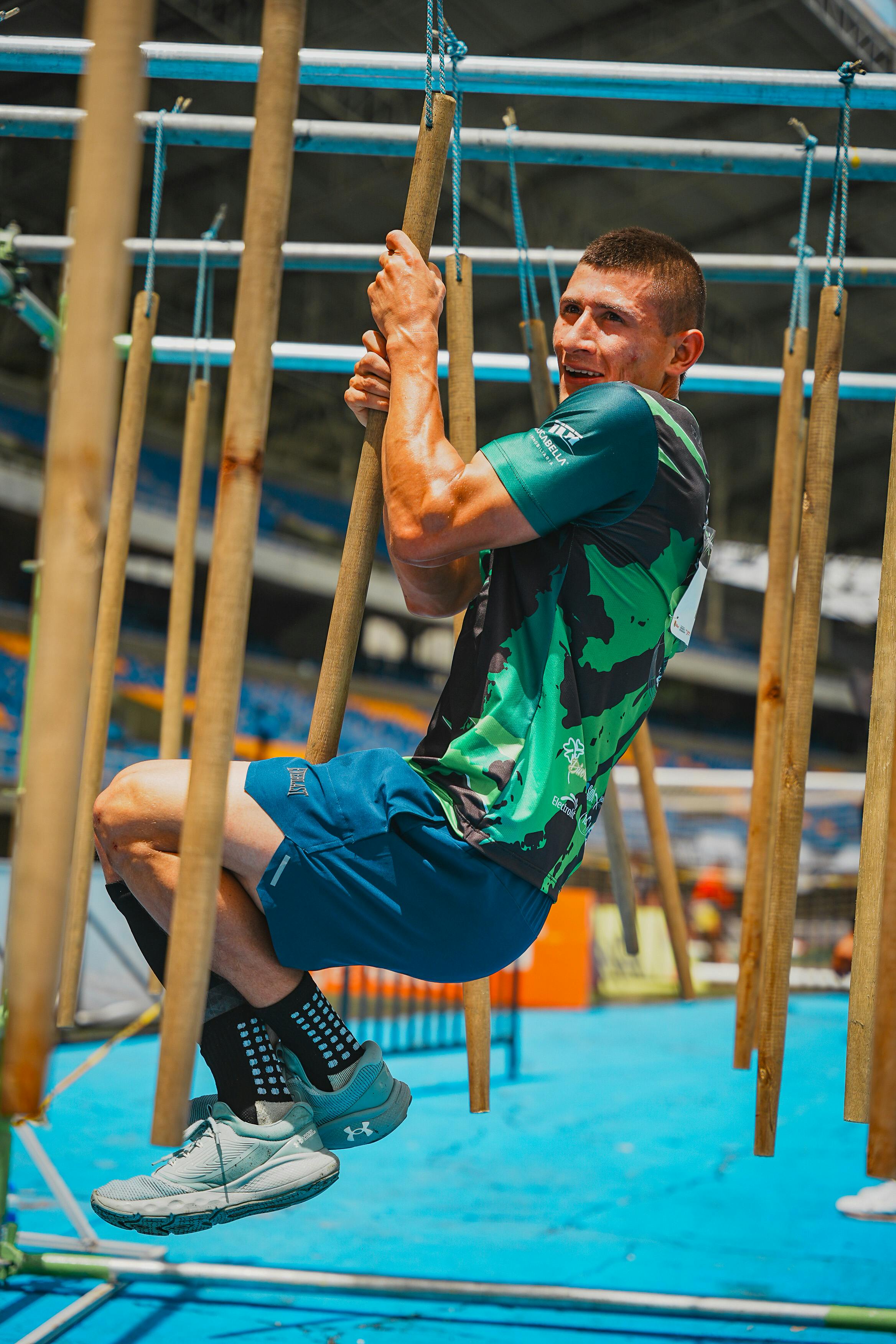 Man Overcoming Obstacle Course · Free Stock Photo