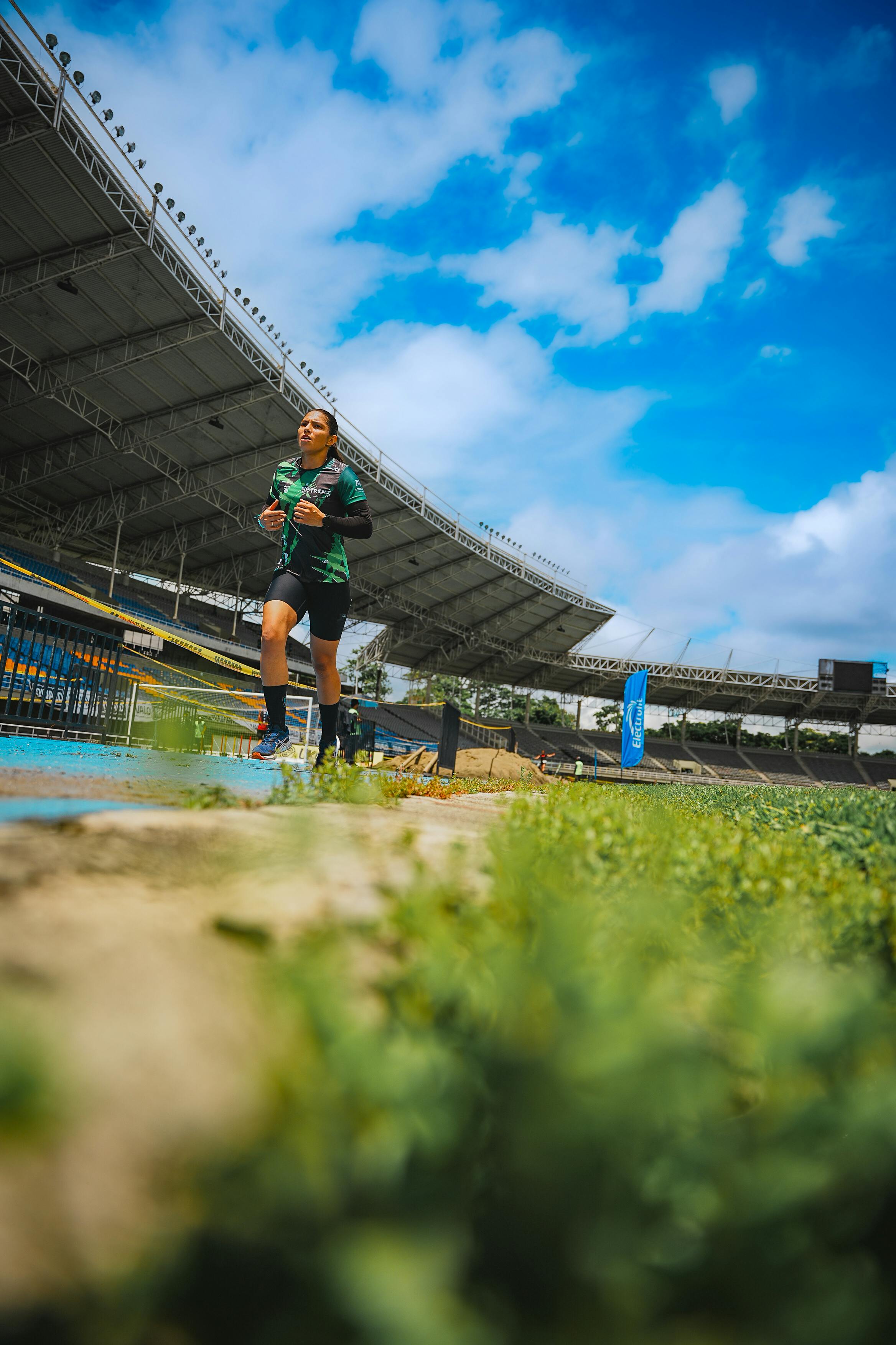 Young Woman Athlete Running on Stadium · Free Stock Photo