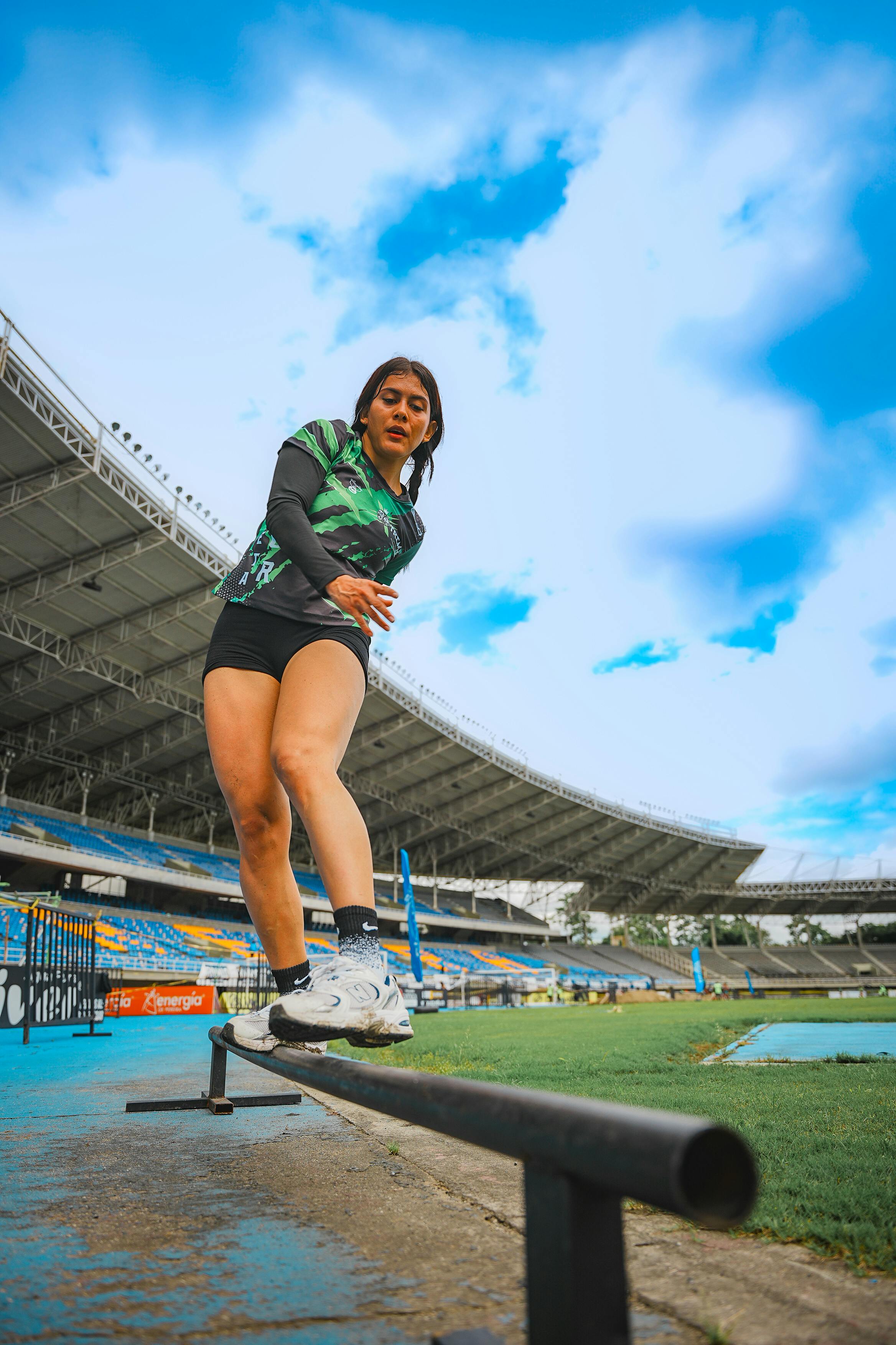 Brunette Woman Balancing on Black Tube in Obstacle Course · Free Stock ...