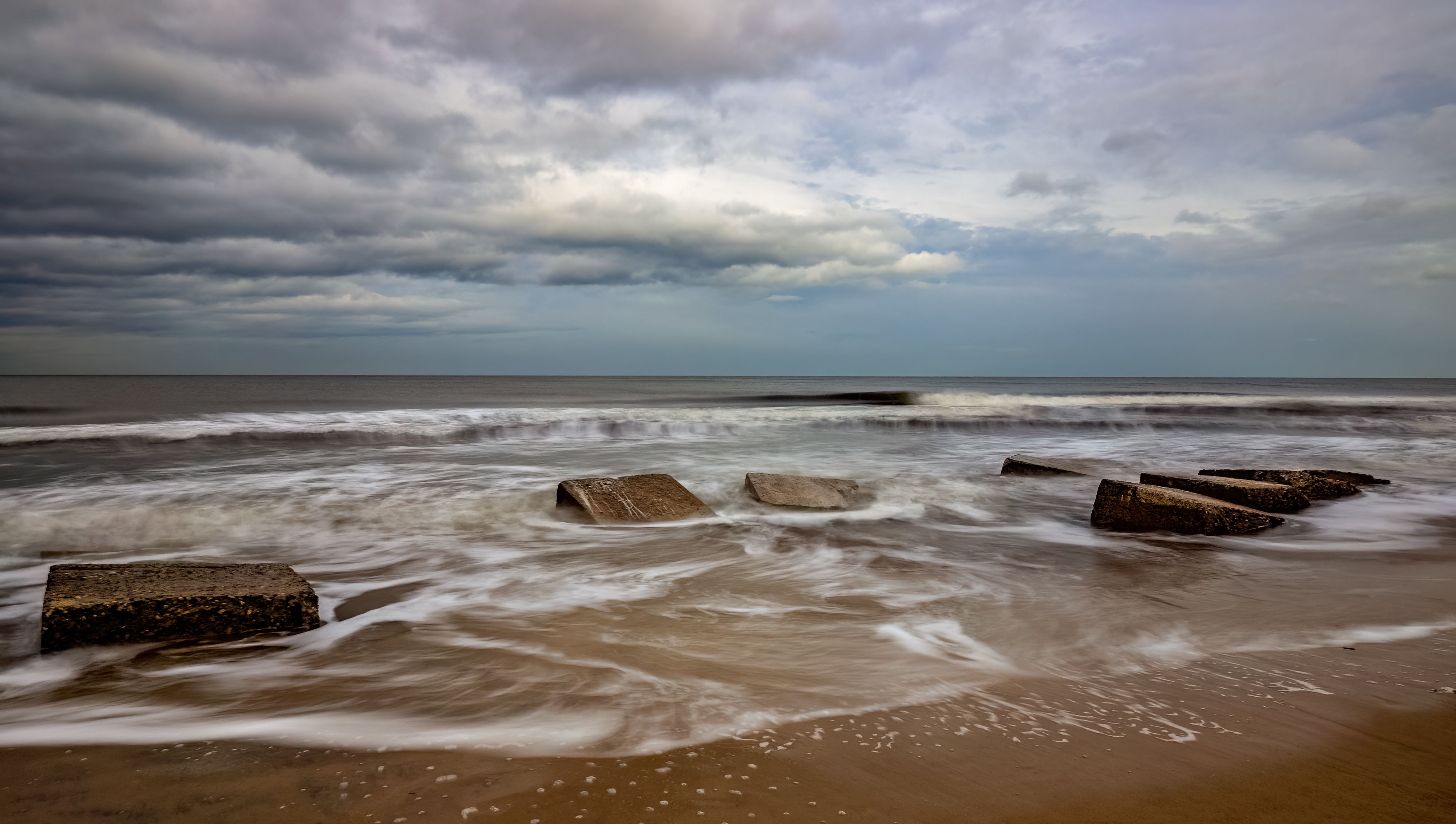 Concrete Blocks in Sand at Beach · Free Stock Photo