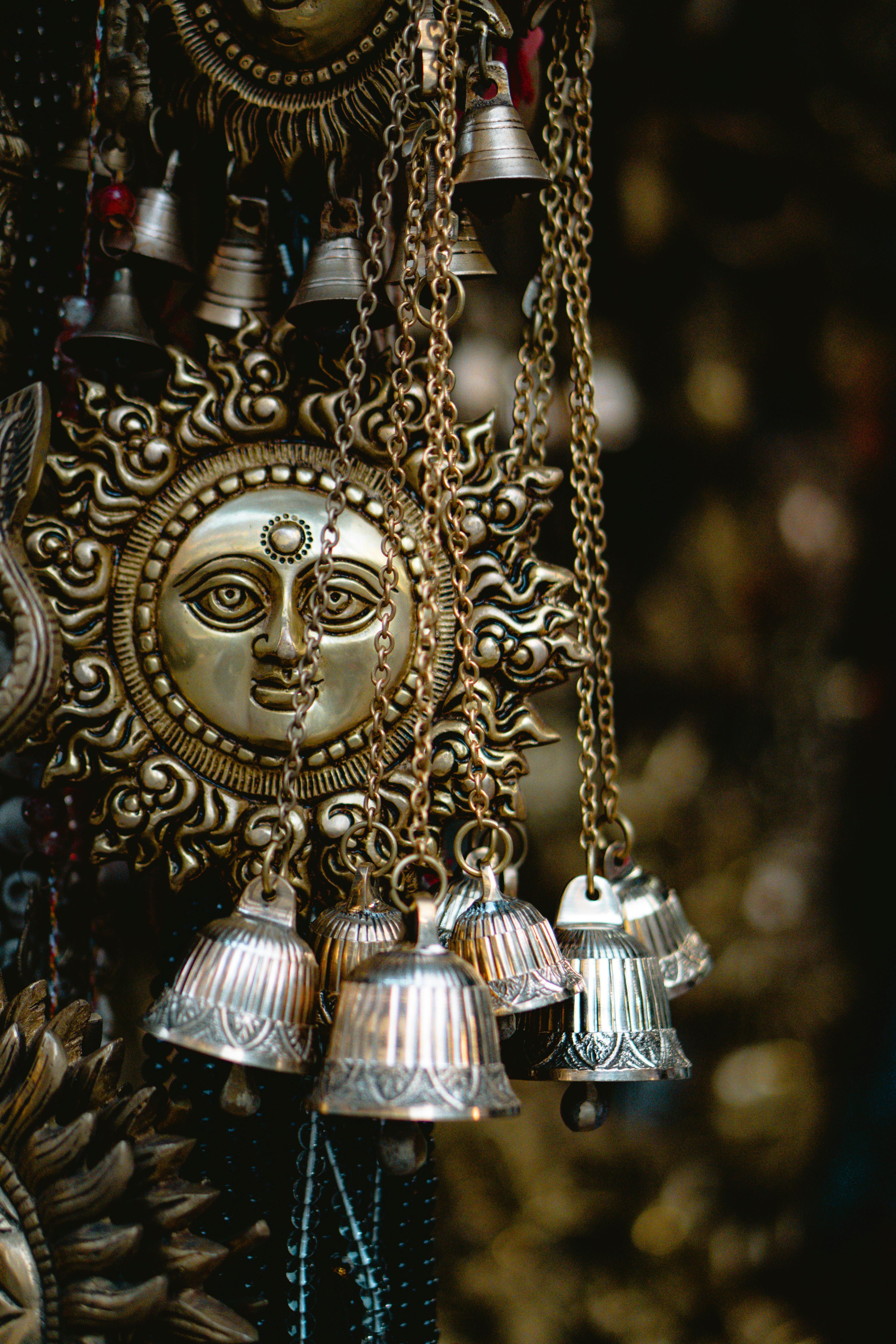 Small Decorative Bells and an Anthropomorphic Sun · Free Stock Photo