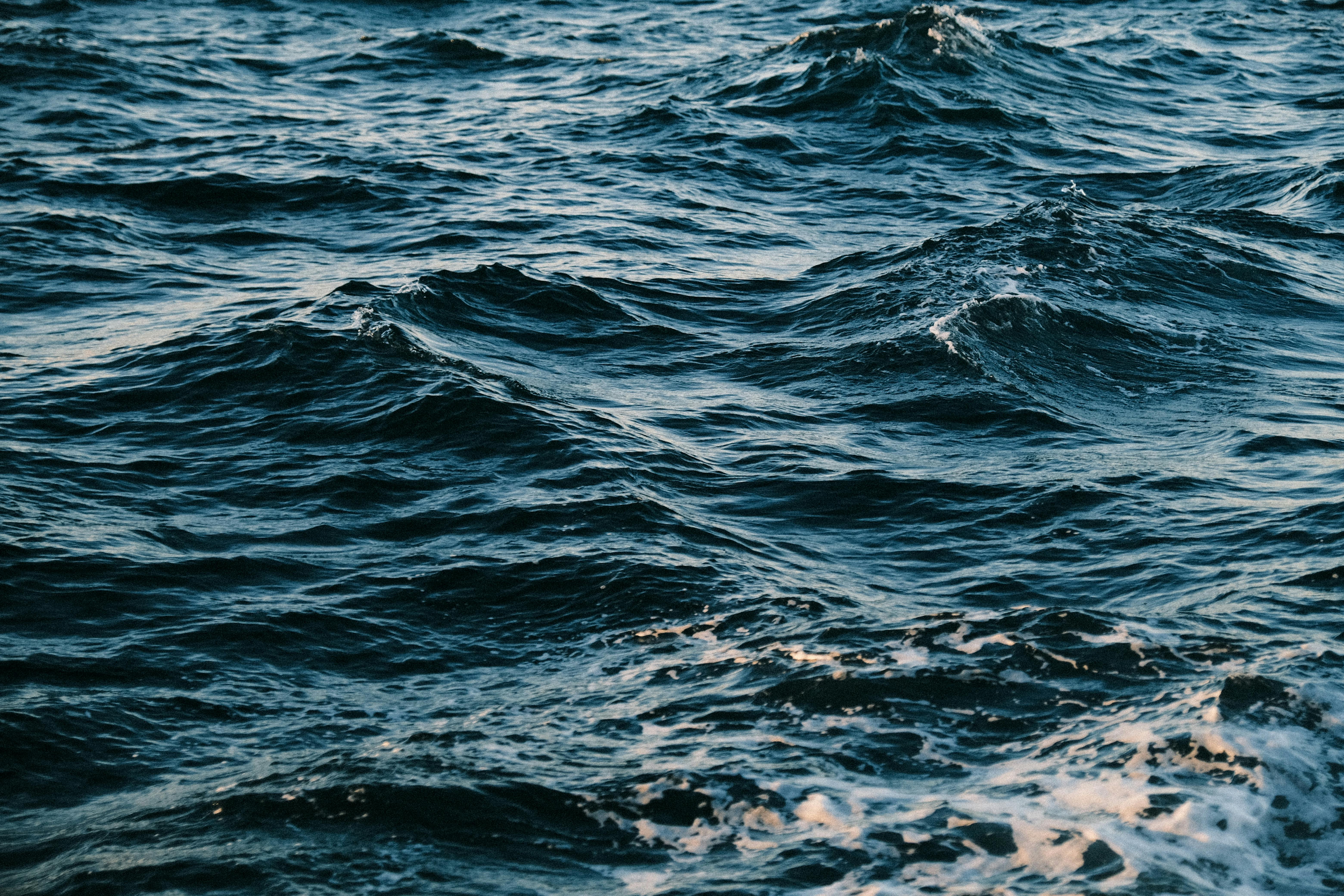 The ocean is calm and rough with waves · Free Stock Photo
