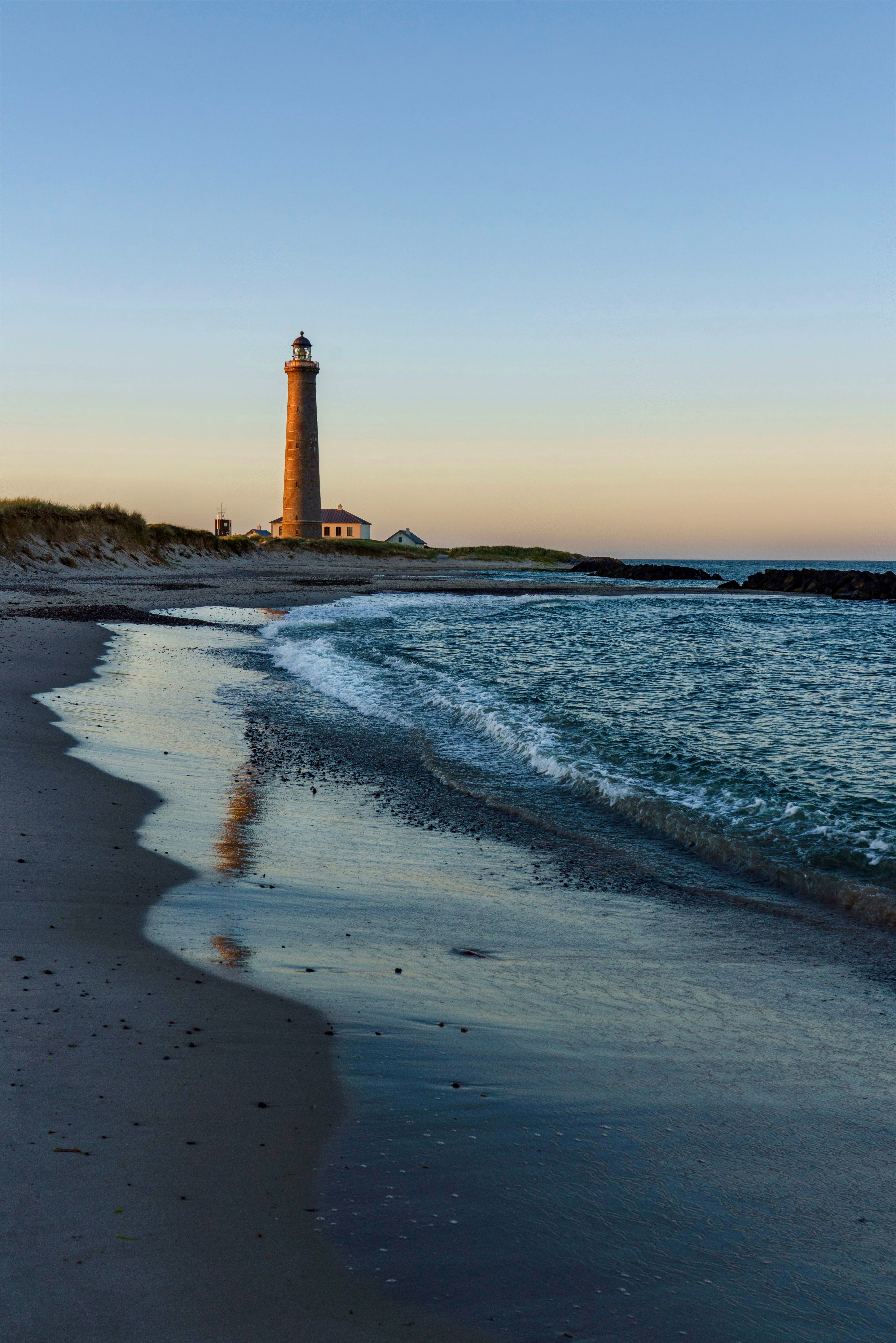 A Lighthouse at Sunset · Free Stock Photo