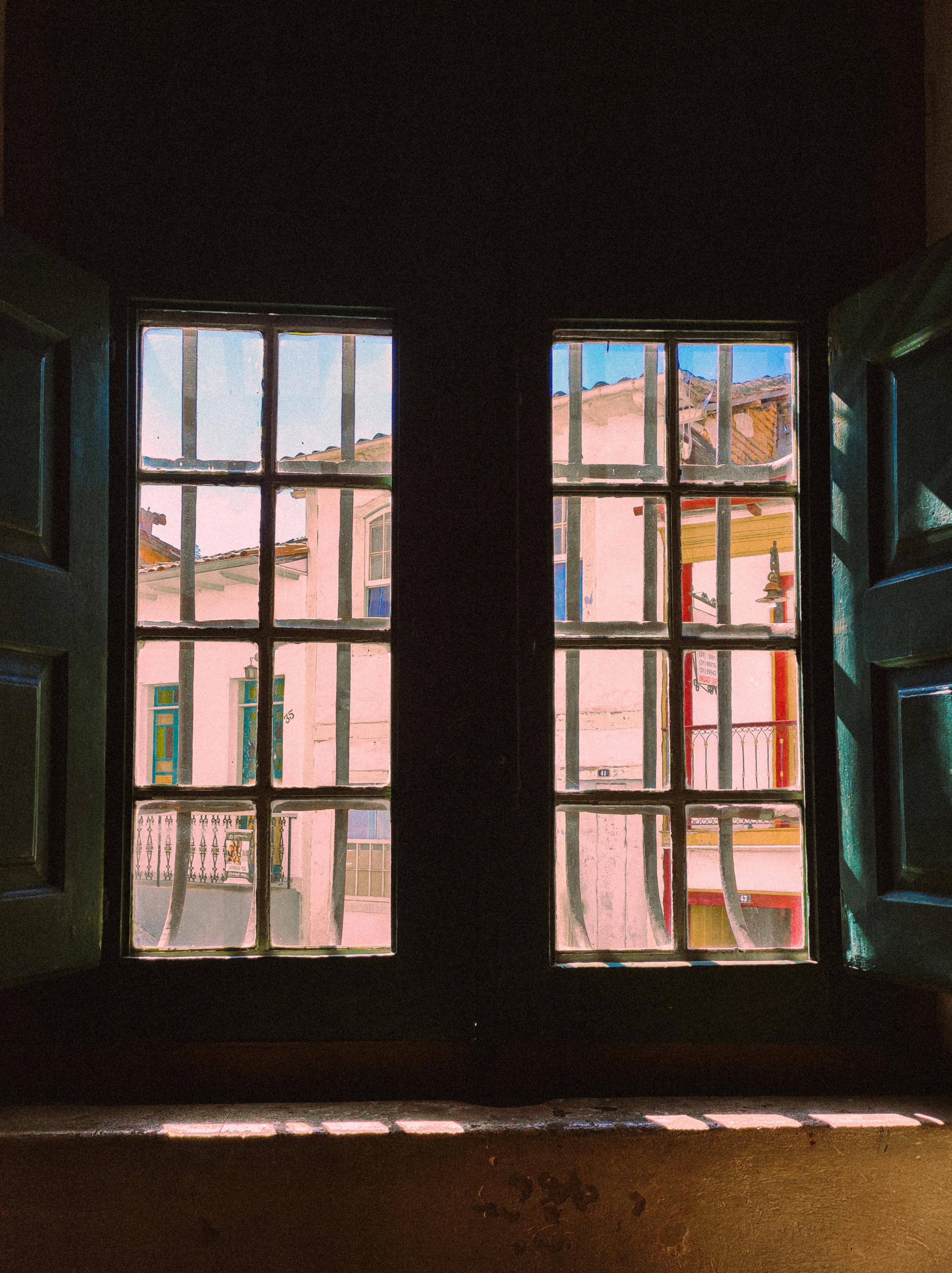 Barred Window with Interior Wooden Shutters · Free Stock Photo