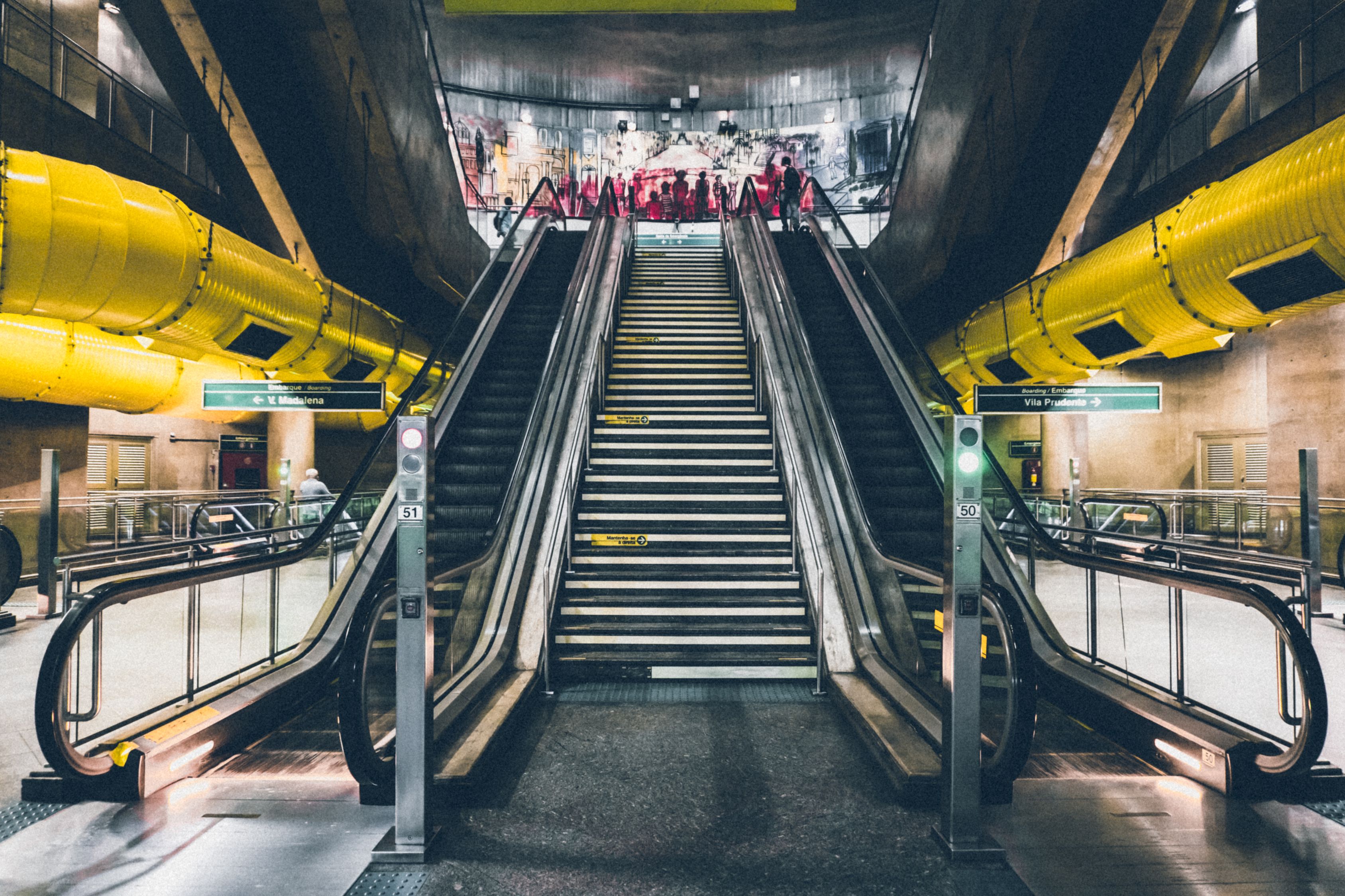 Stair In The Middle Of Escalators Free Stock Photo stair-in-the-middle-of-escalators-free-stock-photo
