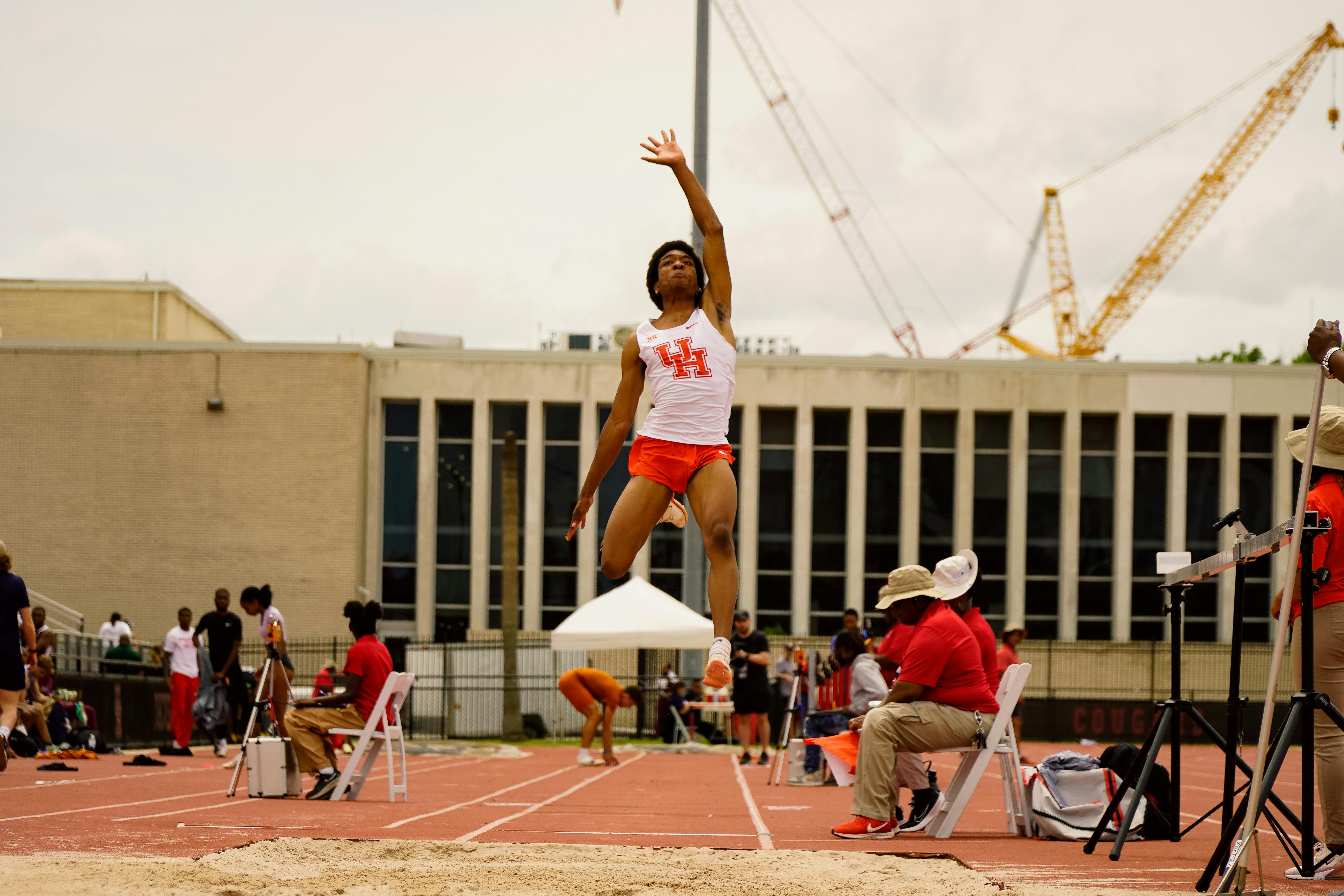 Man Jumping in Long Jump Competition · Free Stock Photo