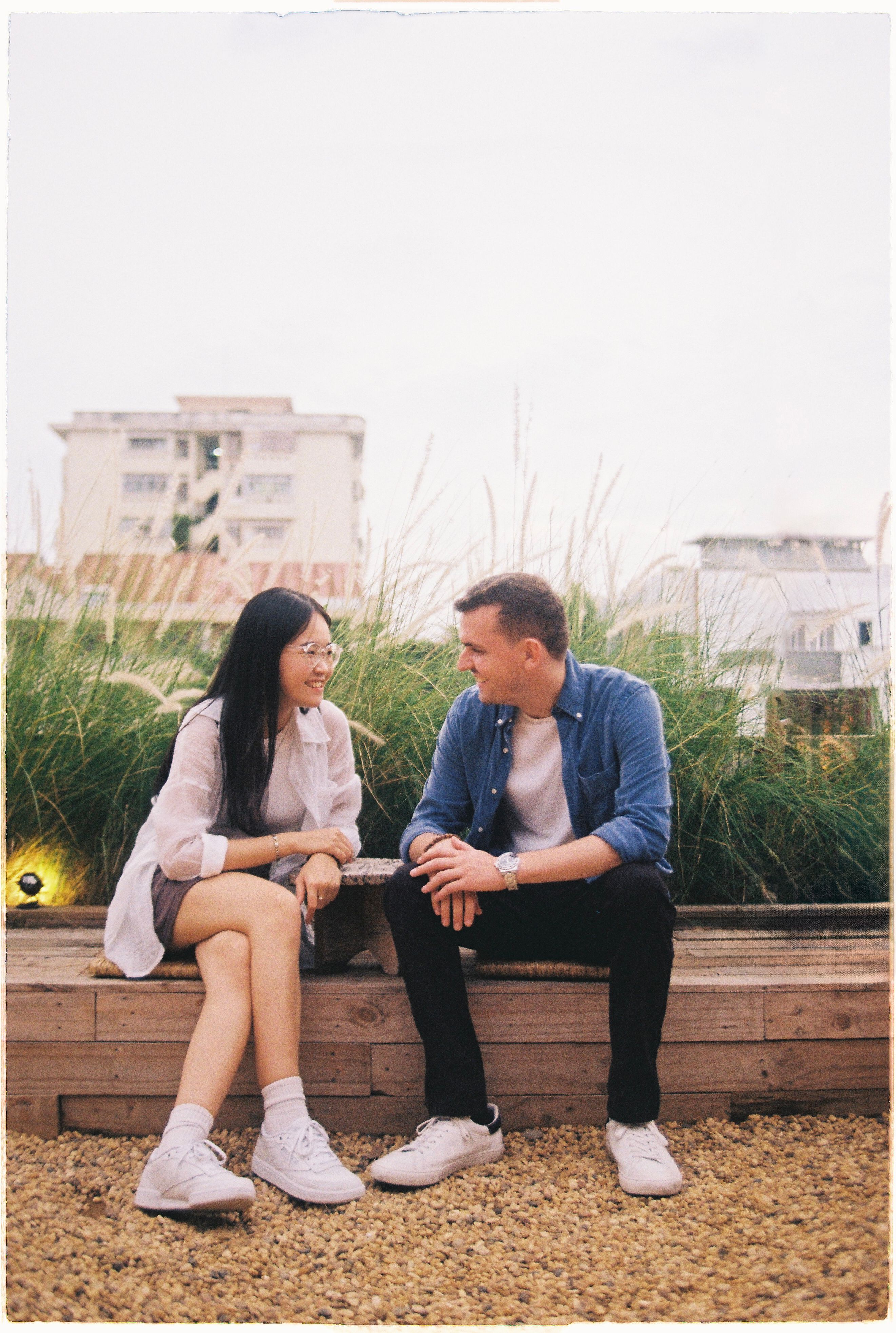 Smiling Couple Sitting on Bench at Park · Free Stock Photo