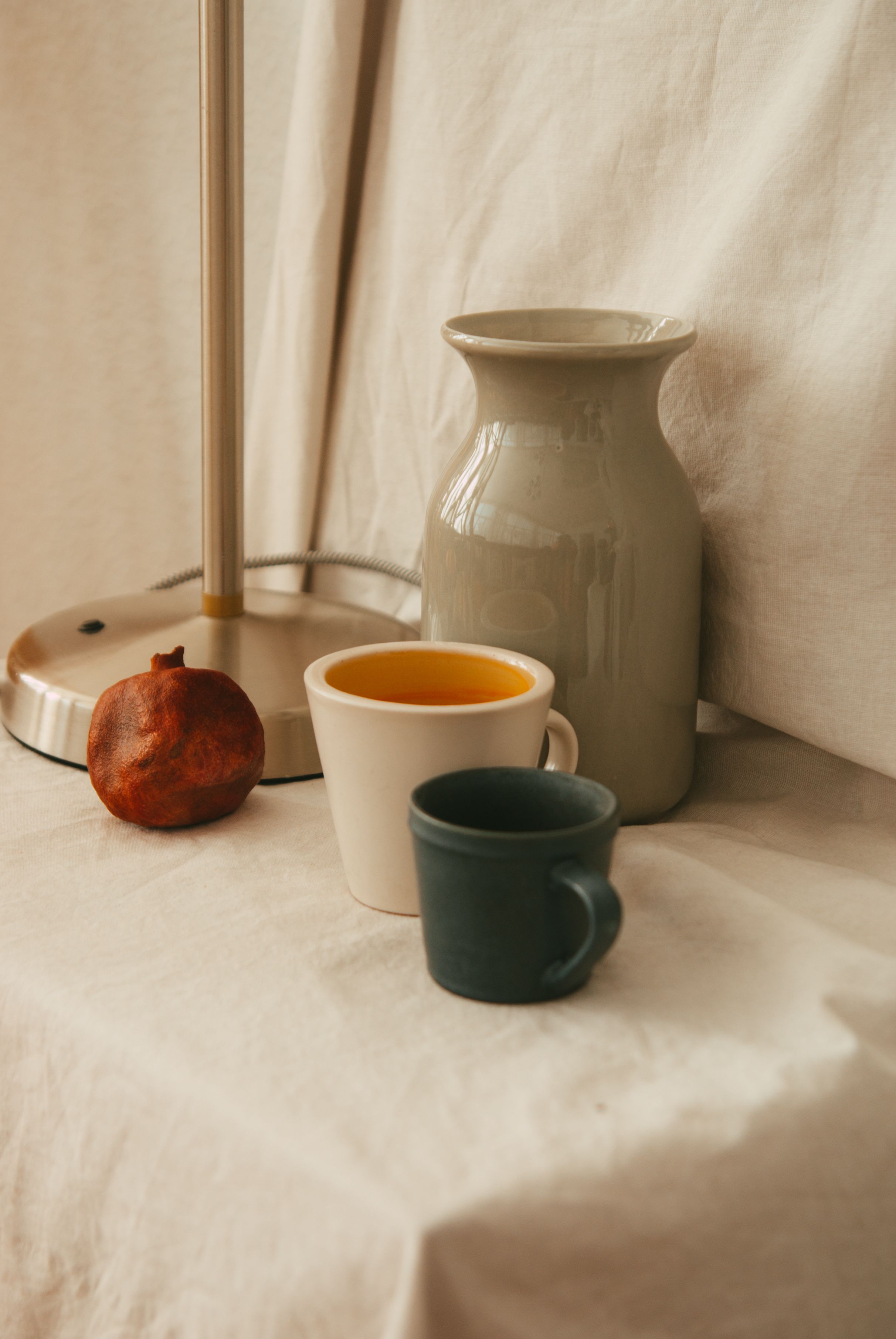 Close-up of Ceramic Cups and a Vase · Free Stock Photo