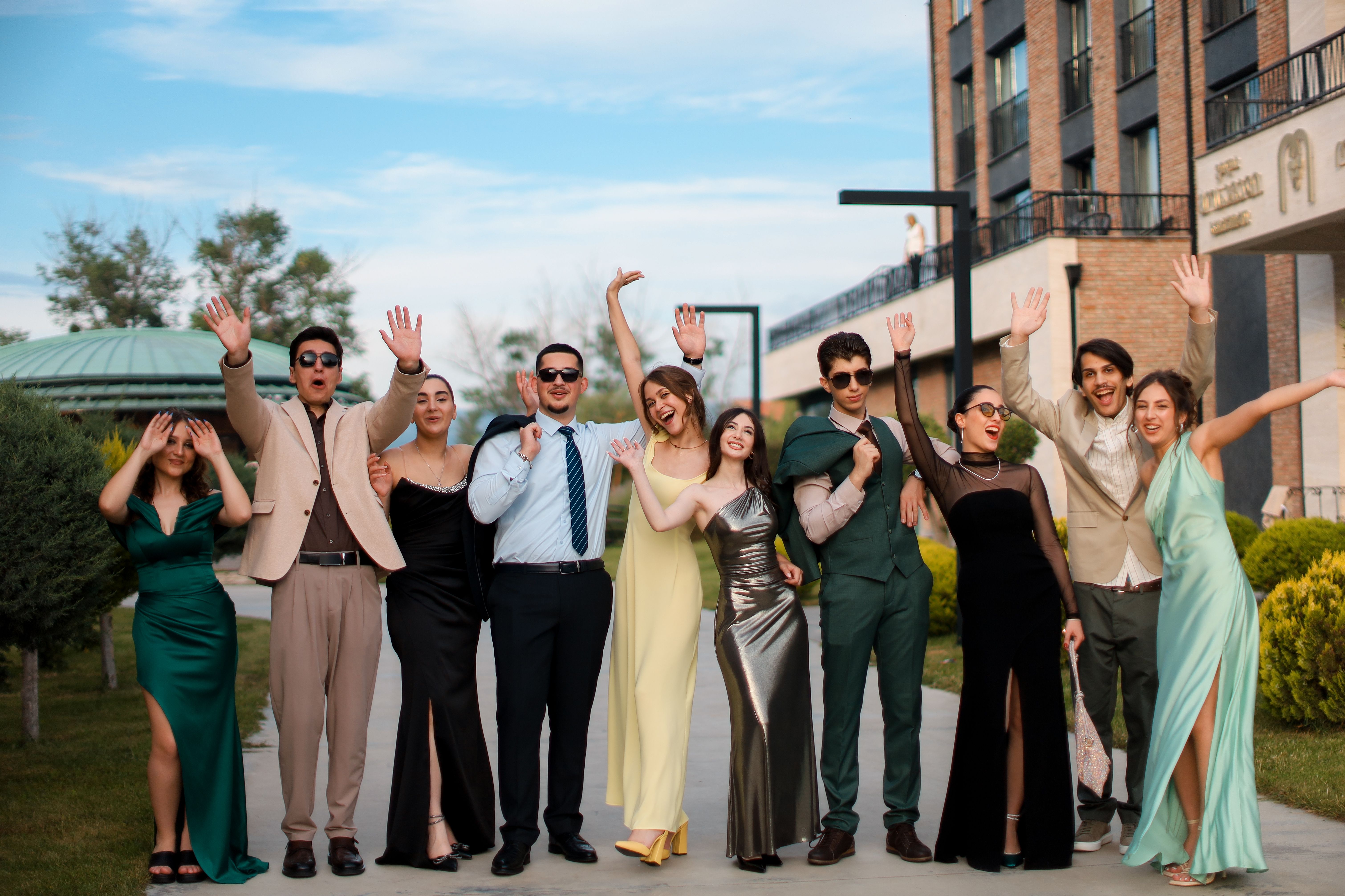A group of people in formal attire posing for a photo · Free Stock Photo
