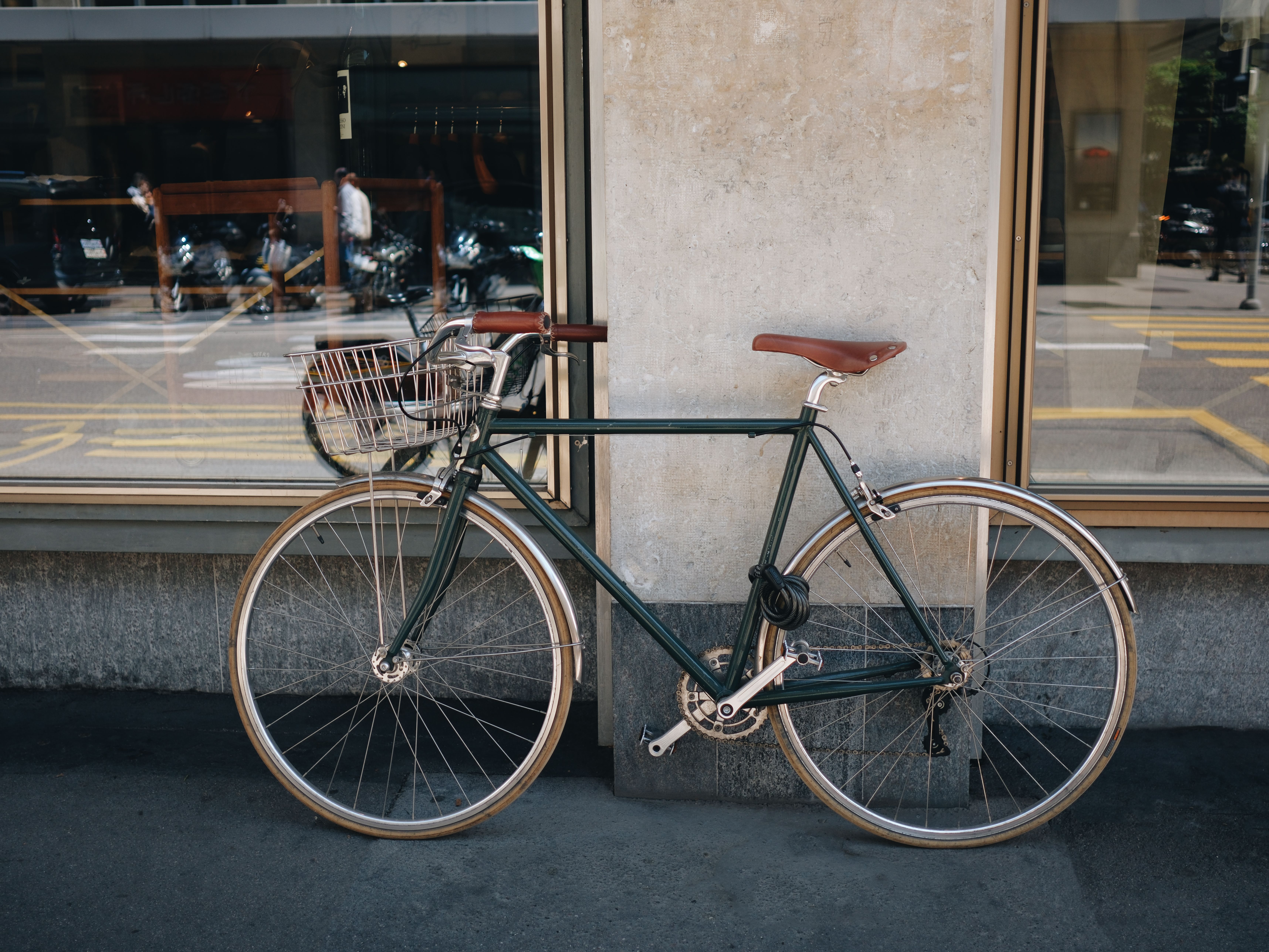 Bicycle with a Basket Leaning against the Building Facade · Free Stock ...