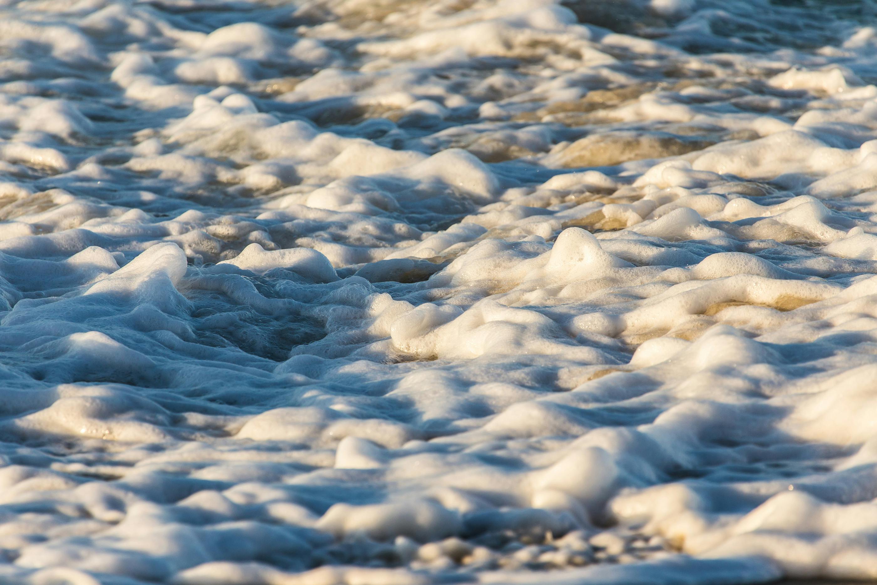 Sea Water Forming Seafoams · Free Stock Photo