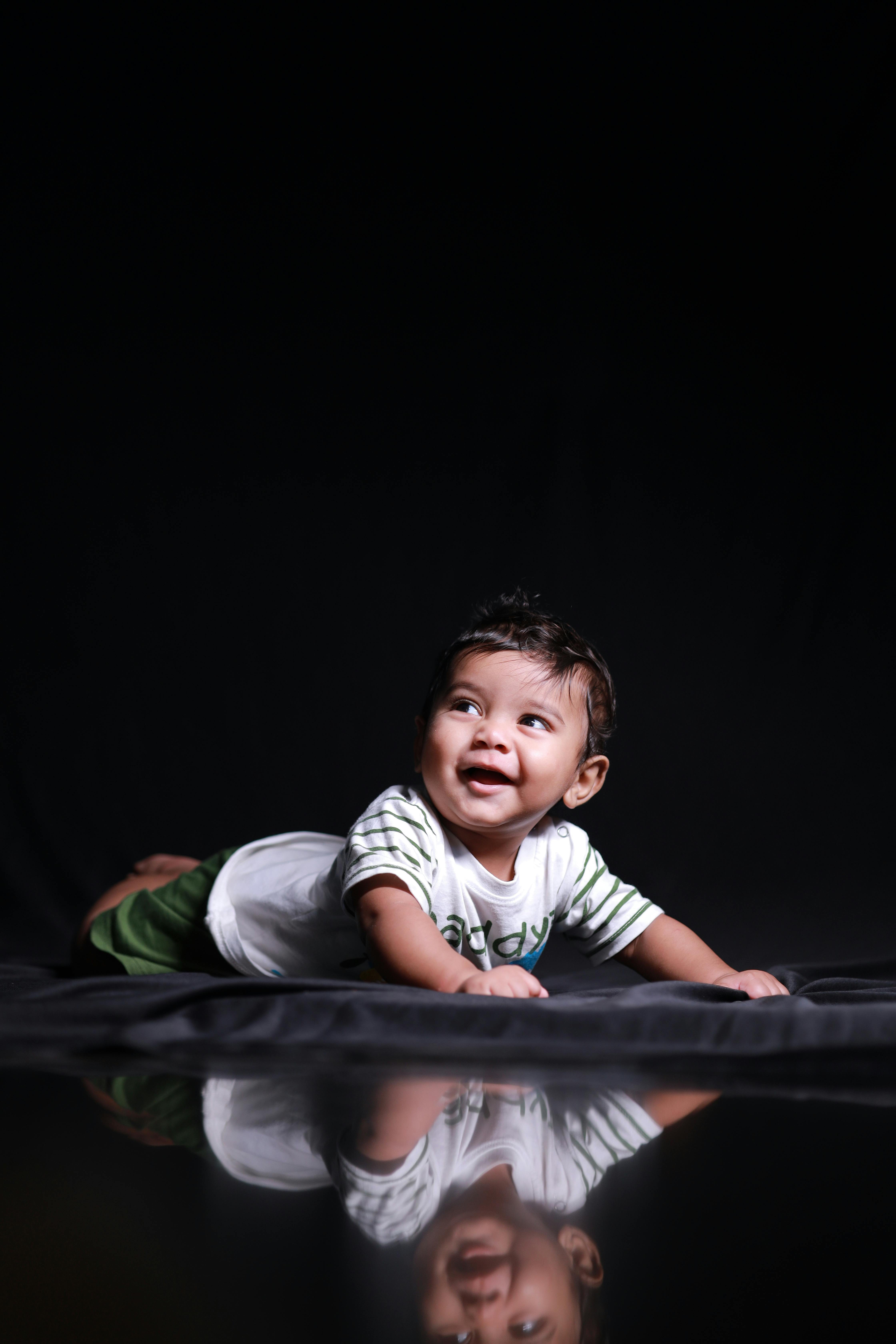 Smiling Toddler Lying Face Down · Free Stock Photo