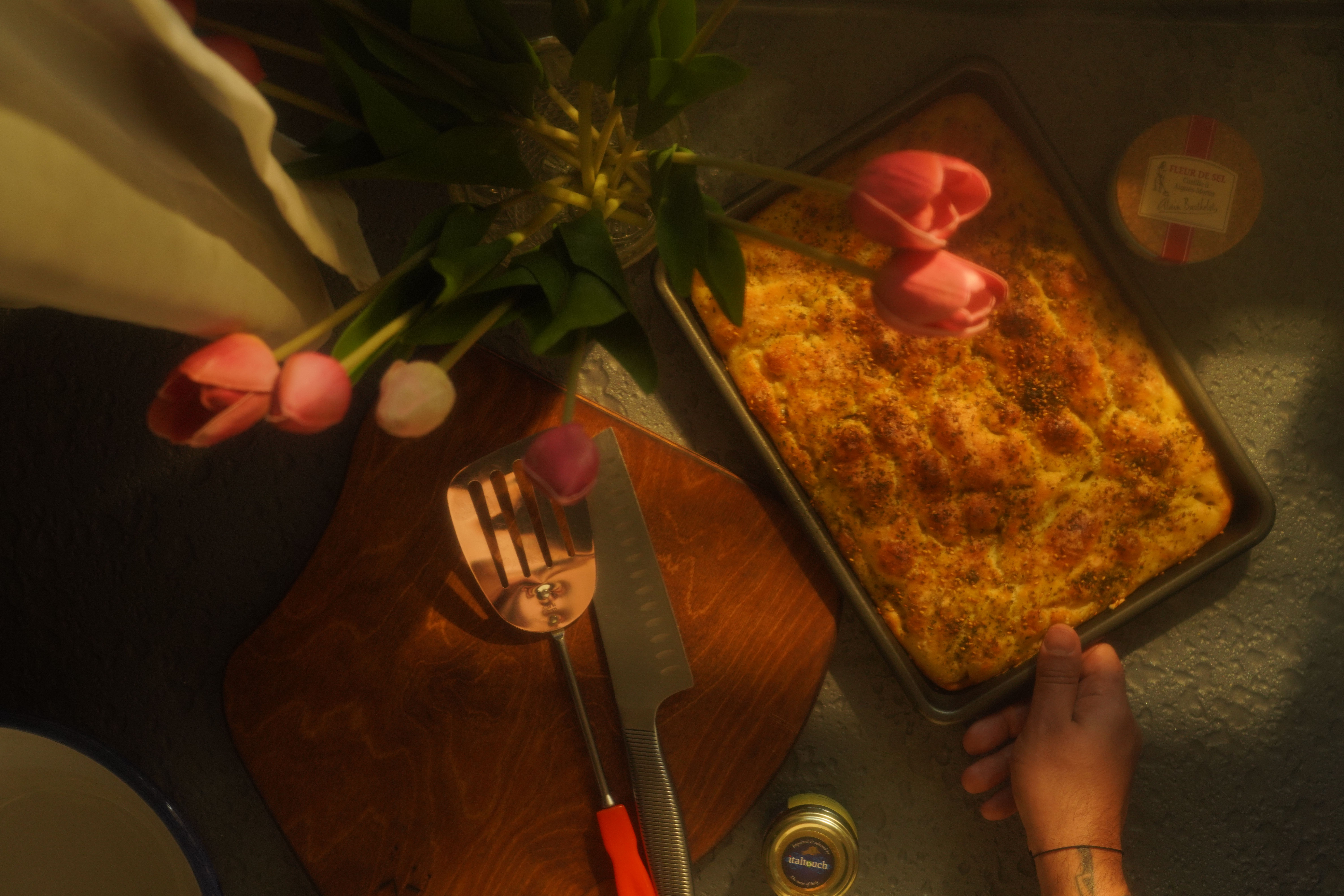 Baked Bread Next to Tulips · Free Stock Photo
