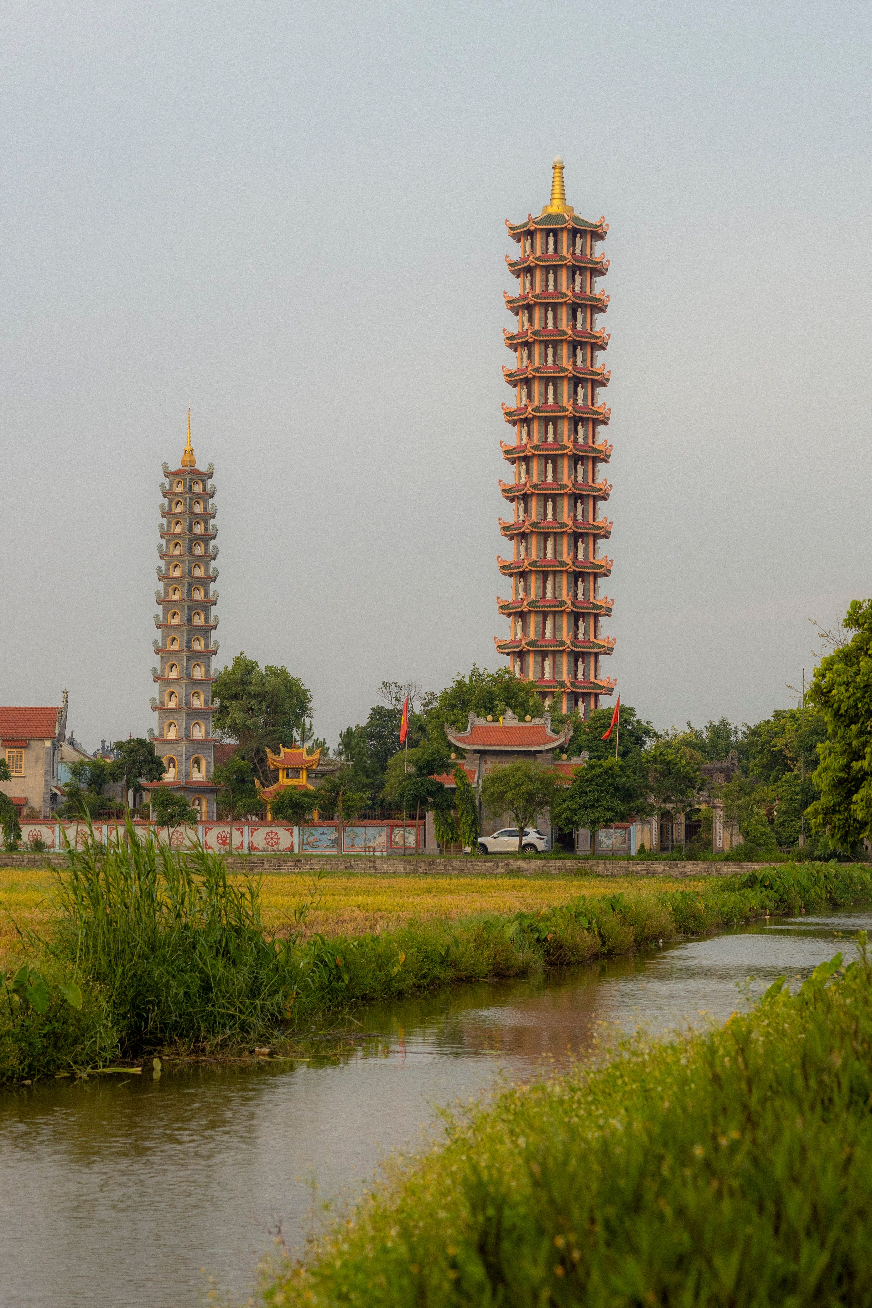 Two tall towers in the middle of a field · Free Stock Photo