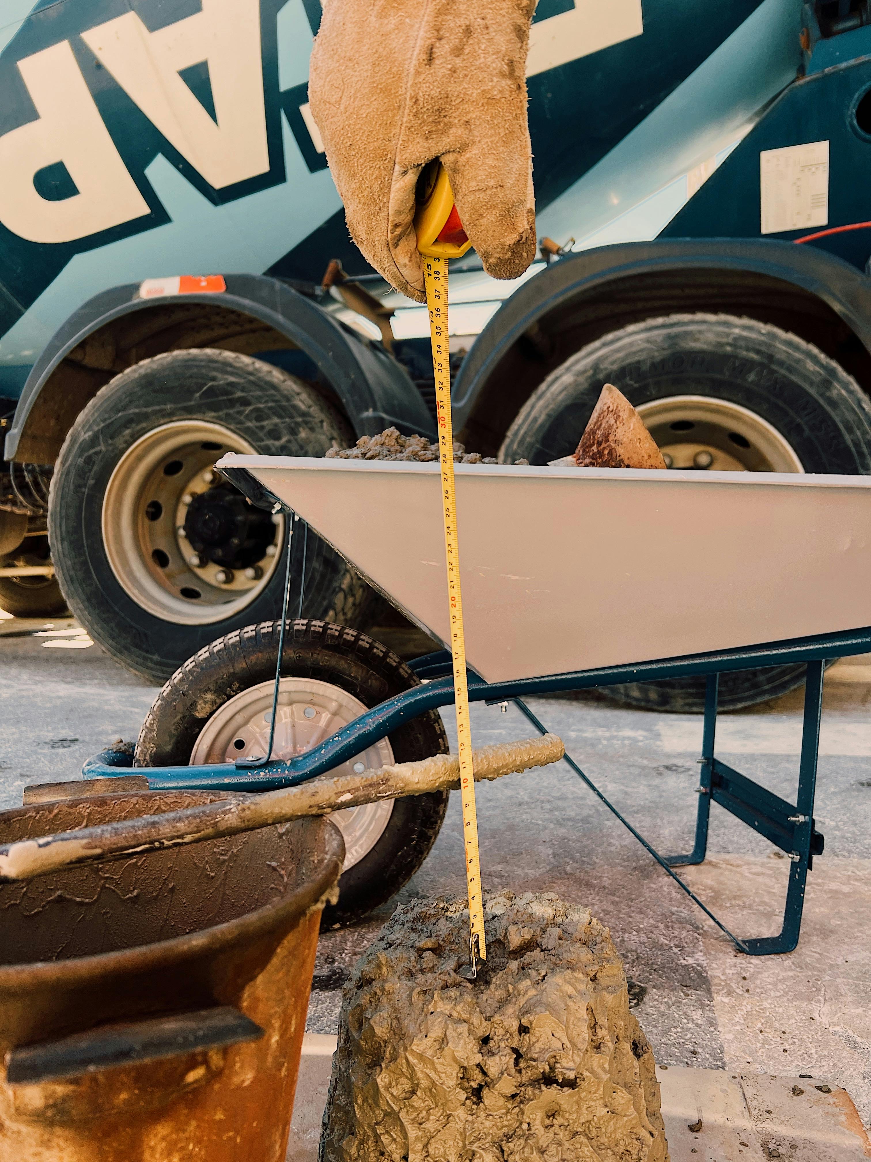 Cement flowing at construction site · Free Stock Photo