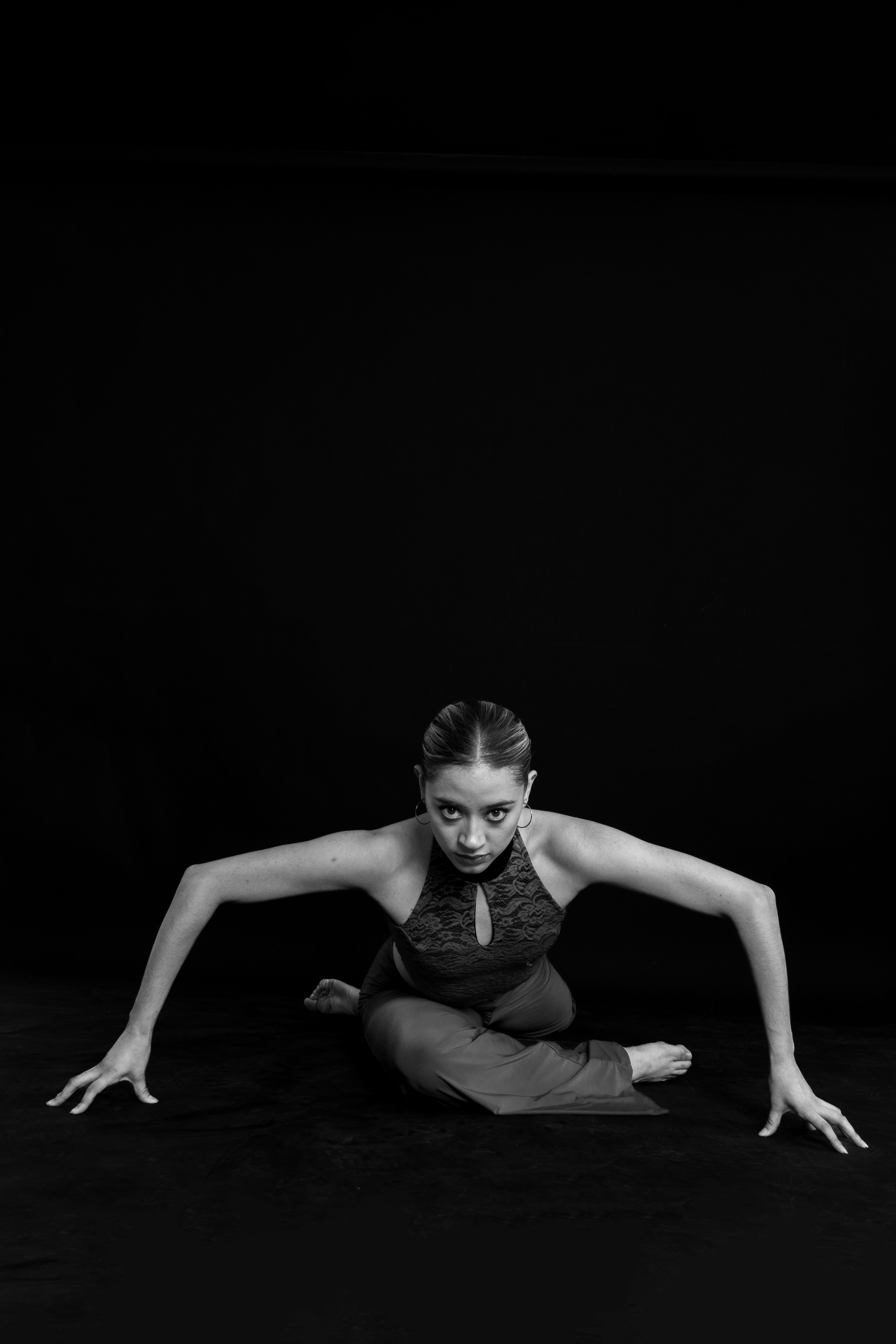 Dancer Sitting in Black and White · Free Stock Photo
