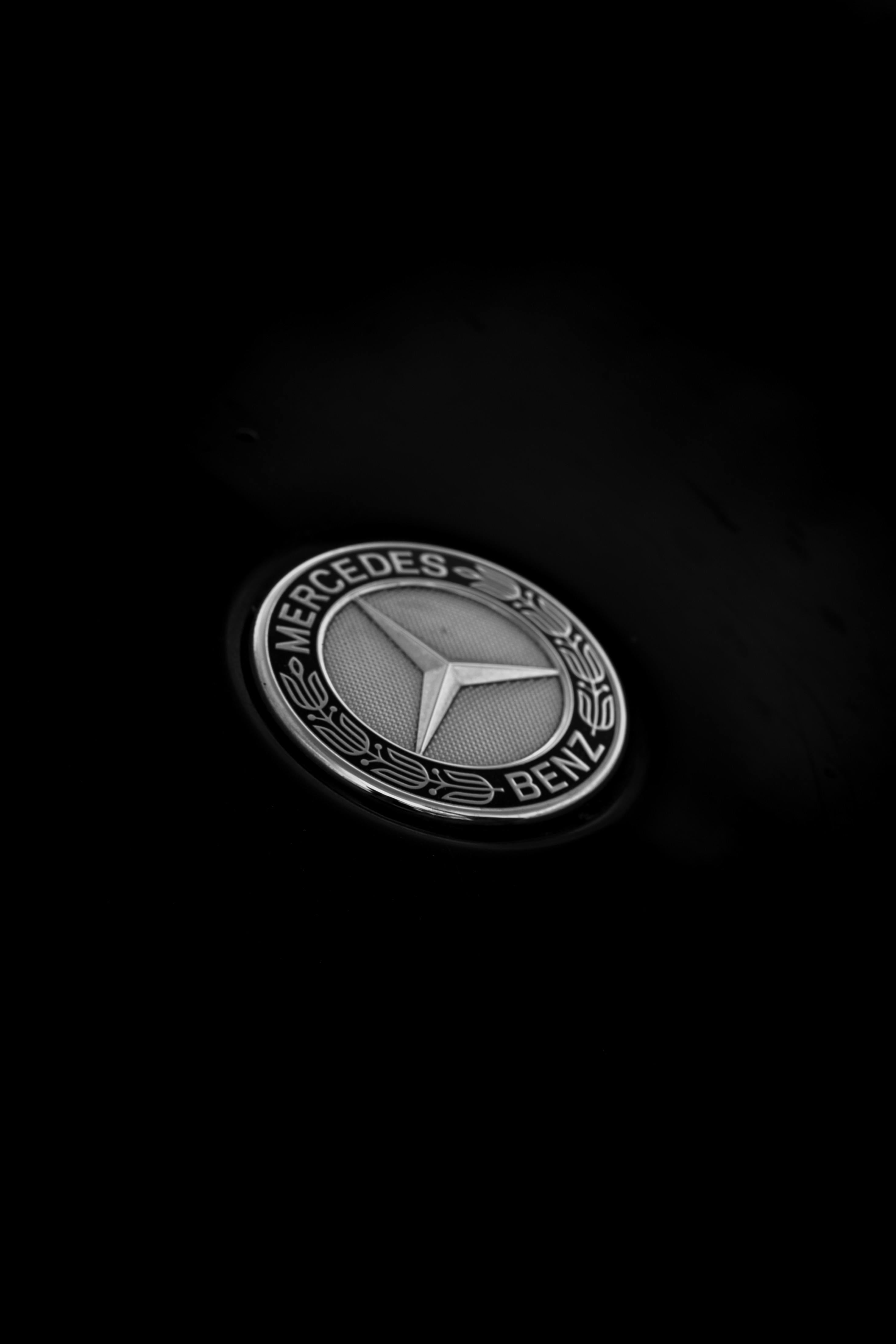 Mercedes Benz Badge on Black Car Hood · Free Stock Photo