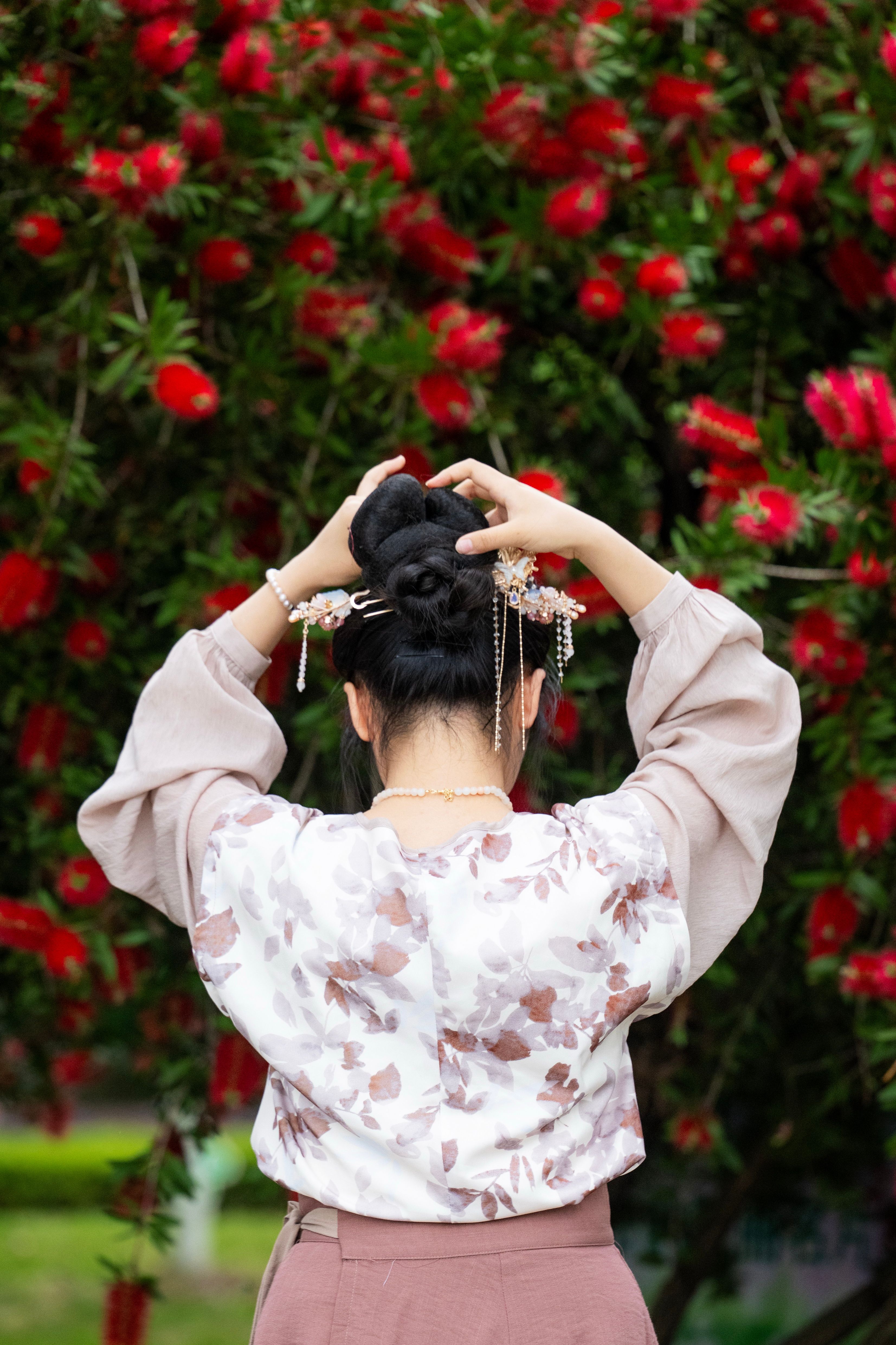 Back View of Woman Standing and Fixing Hair · Free Stock Photo