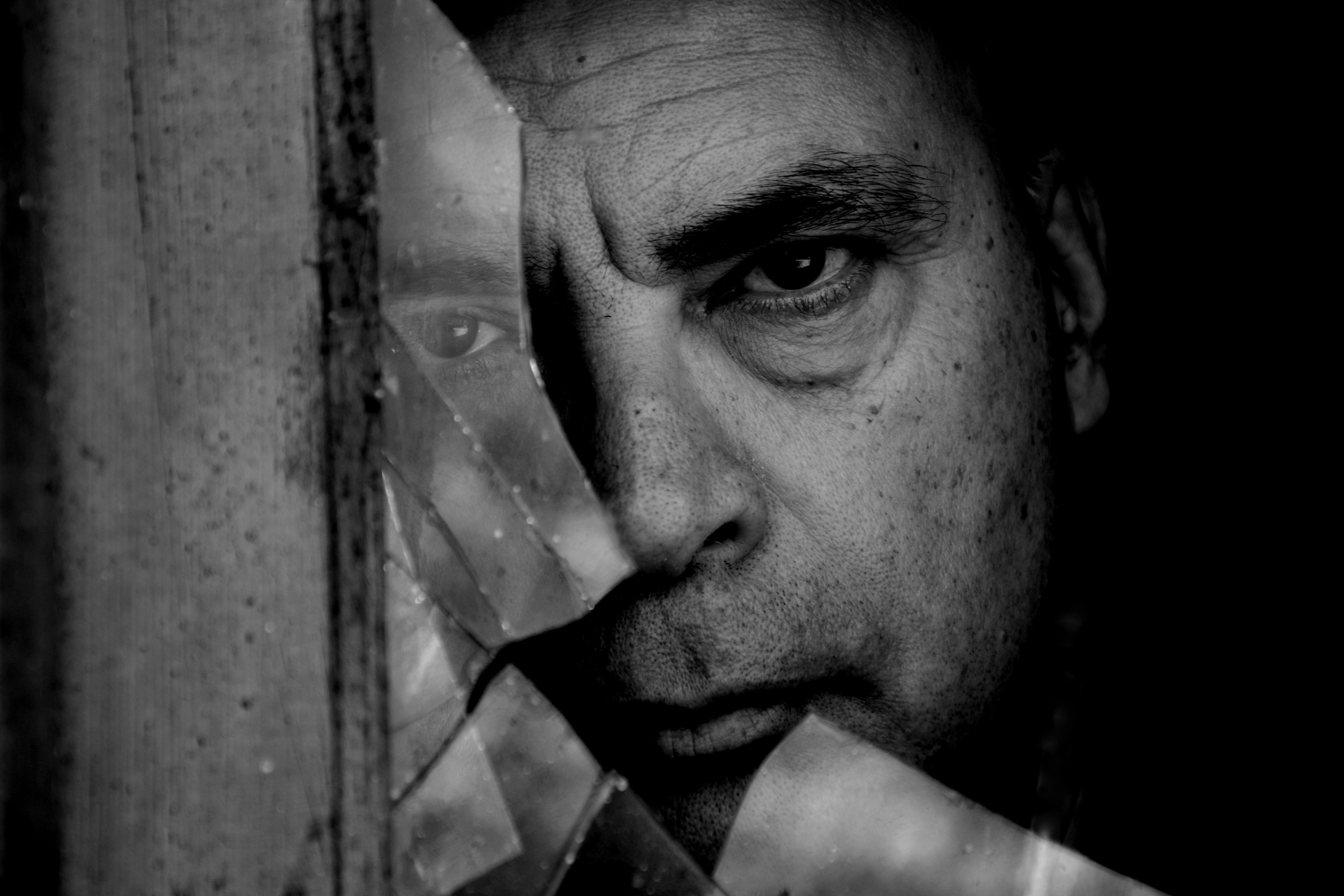 Portrait of Man behind Broken Glass · Free Stock Photo